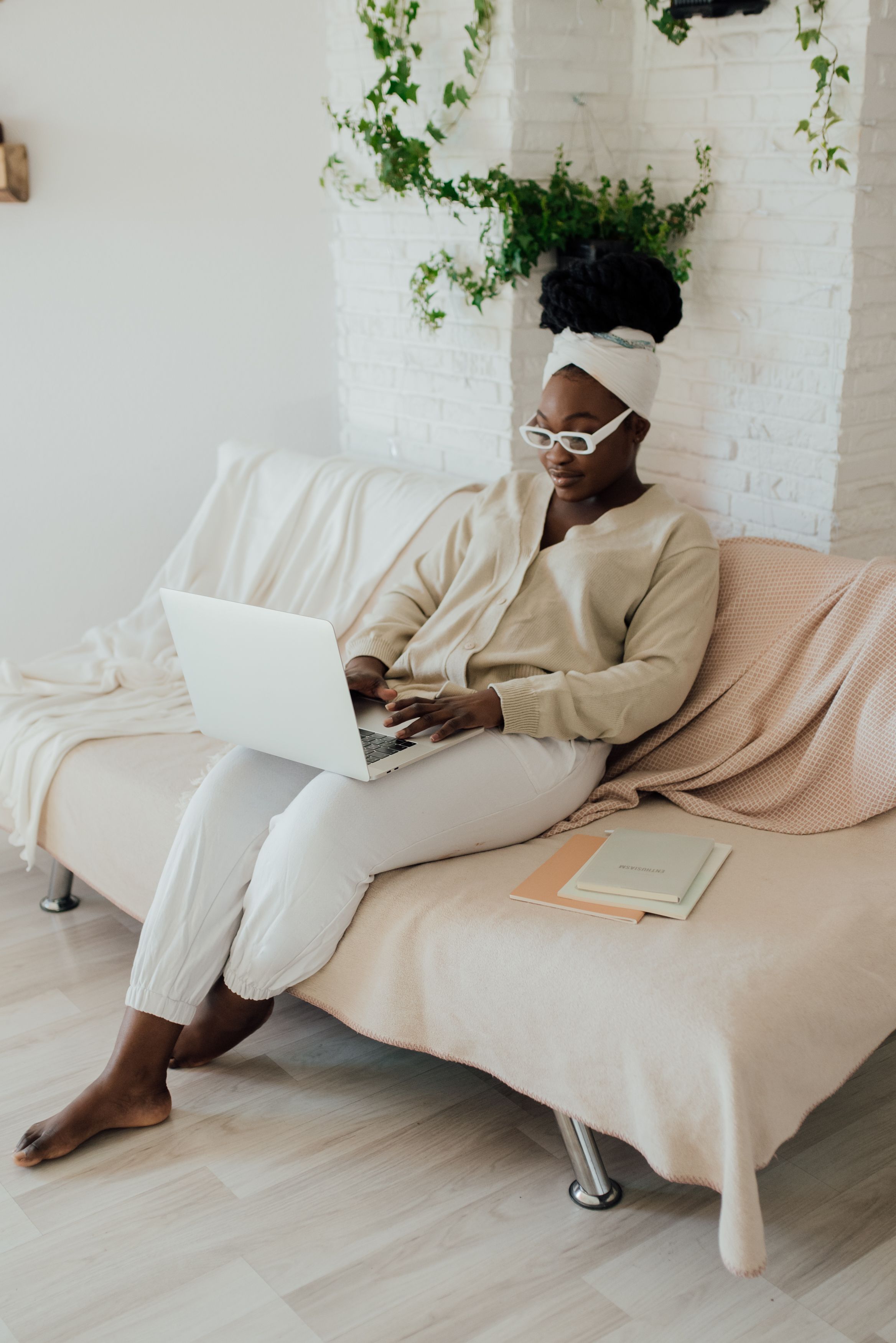 Woman Wearing Cardigan Sitting on a Sofa · Free Stock Photo