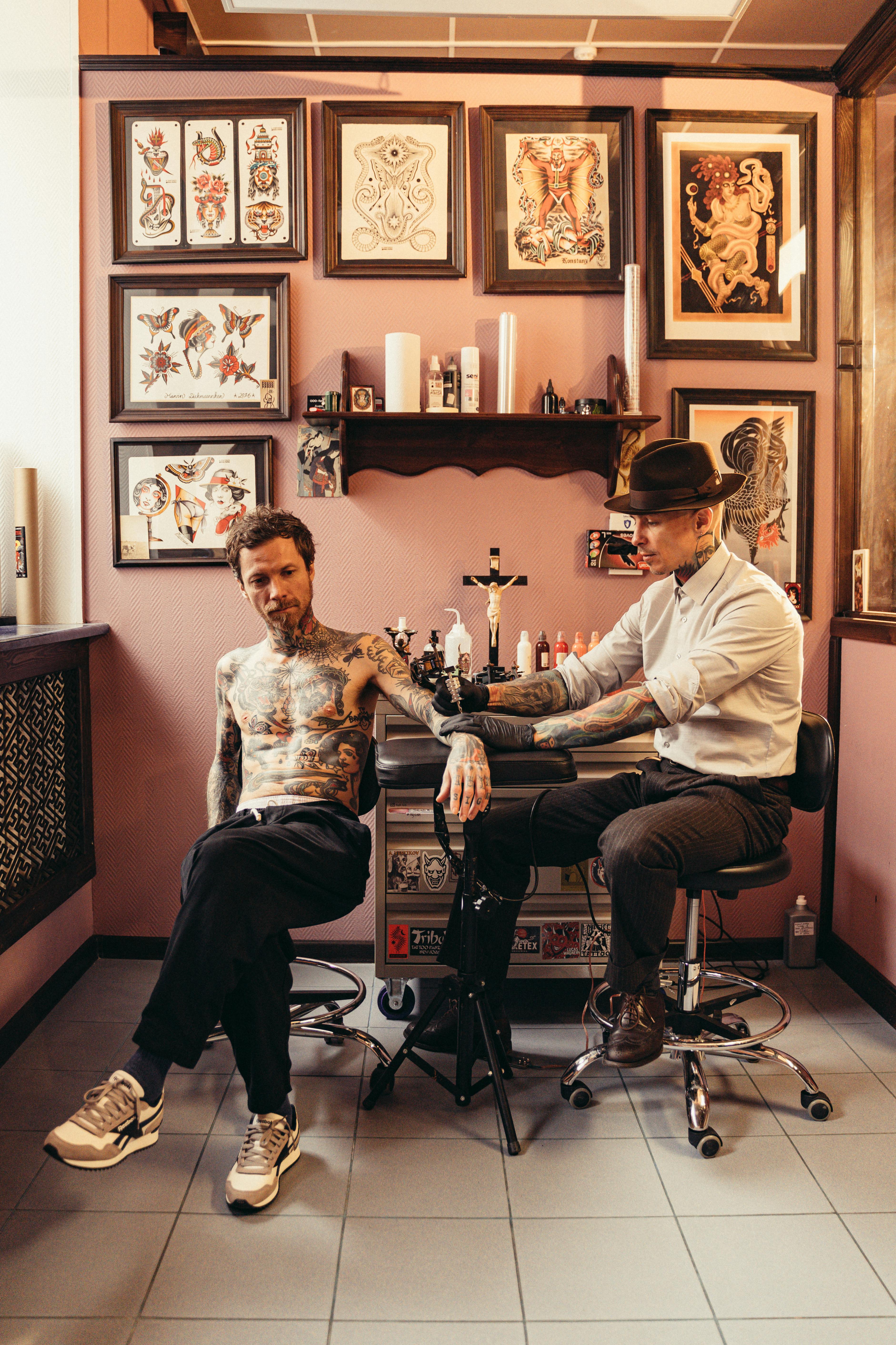 A Shirtless Man Getting a Tattoo · Free Stock Photo