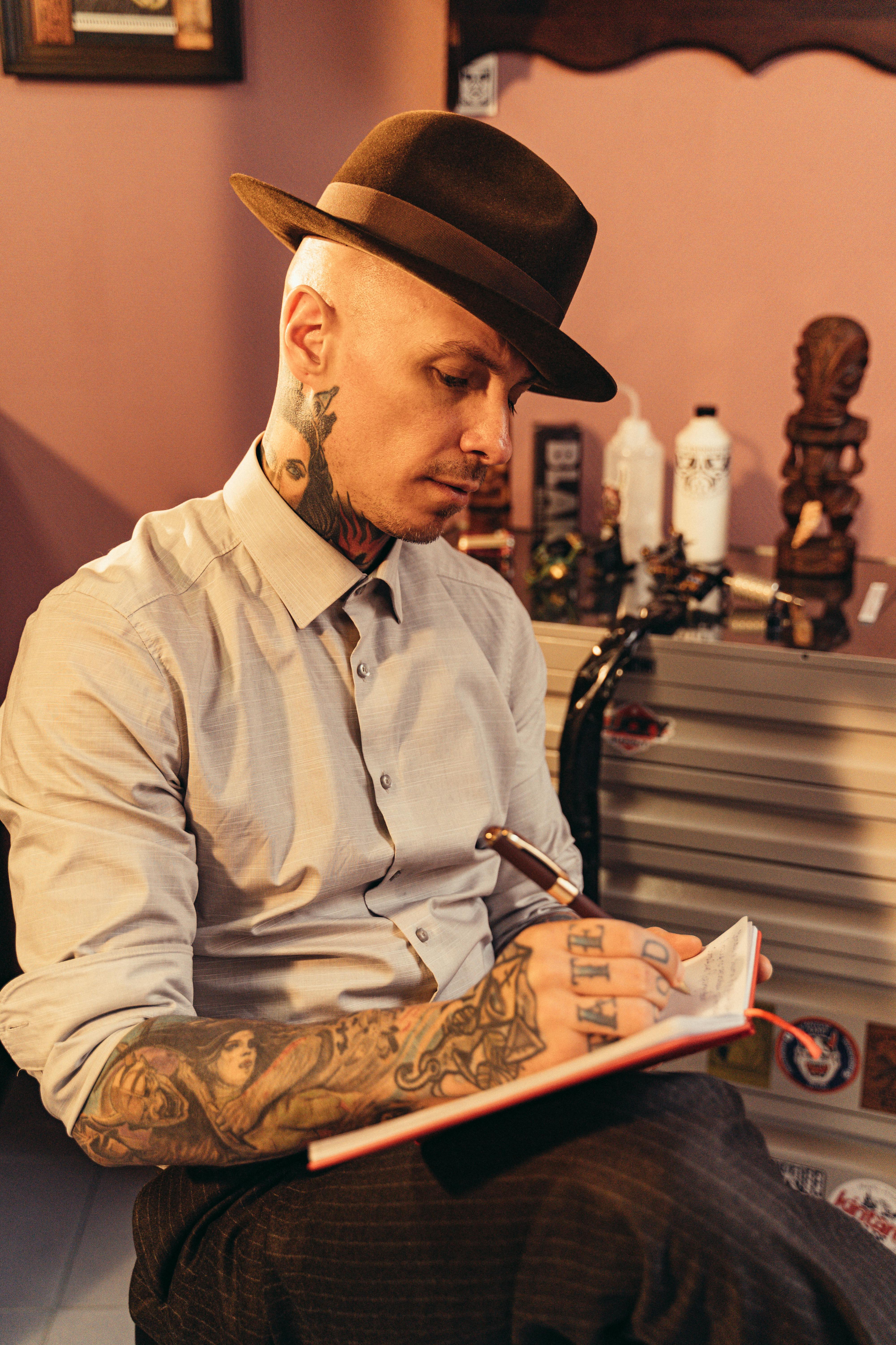 Two Men Writing on Chalkboard · Free Stock Photo