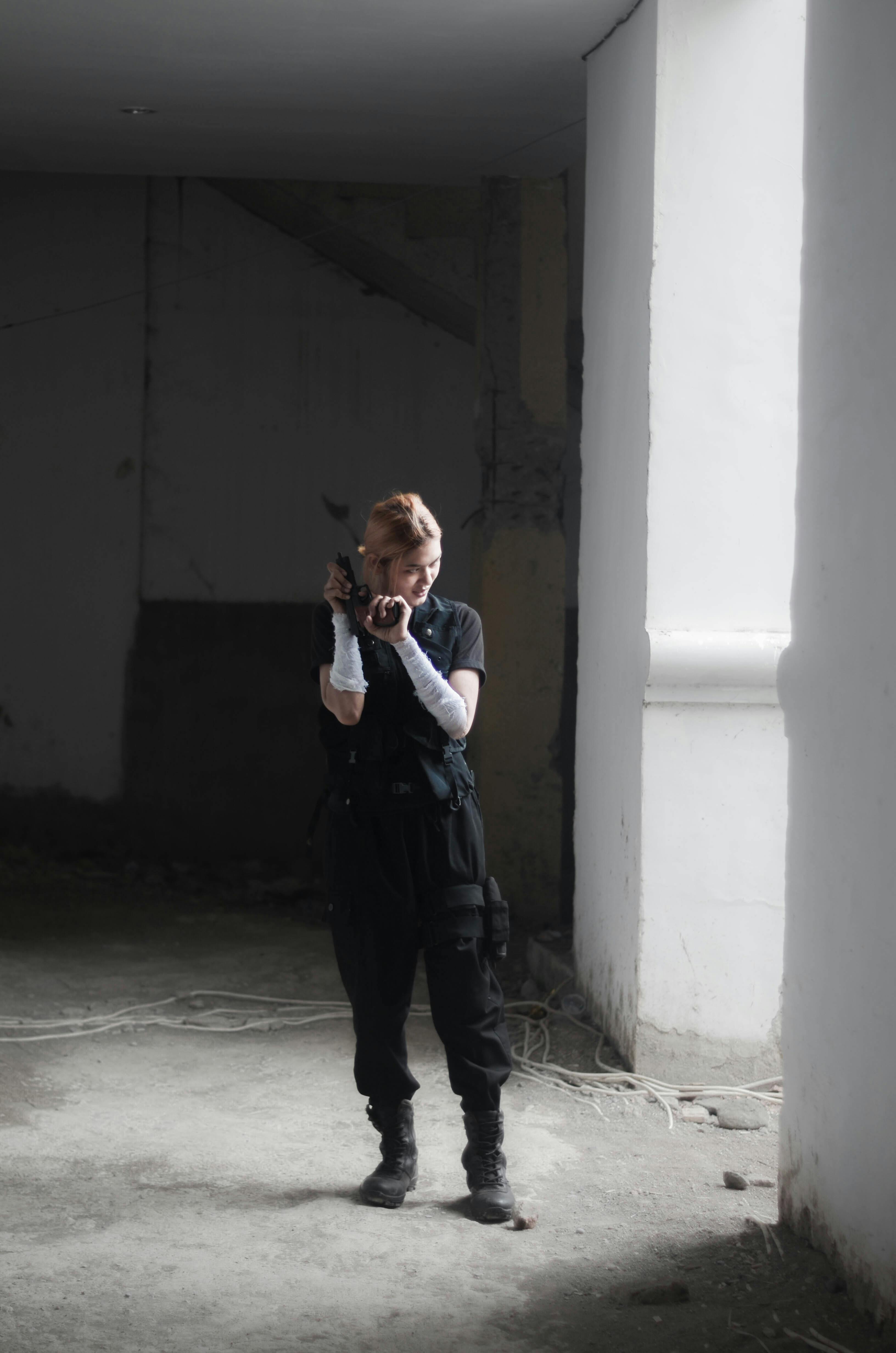 A Person holding Gun · Free Stock Photo