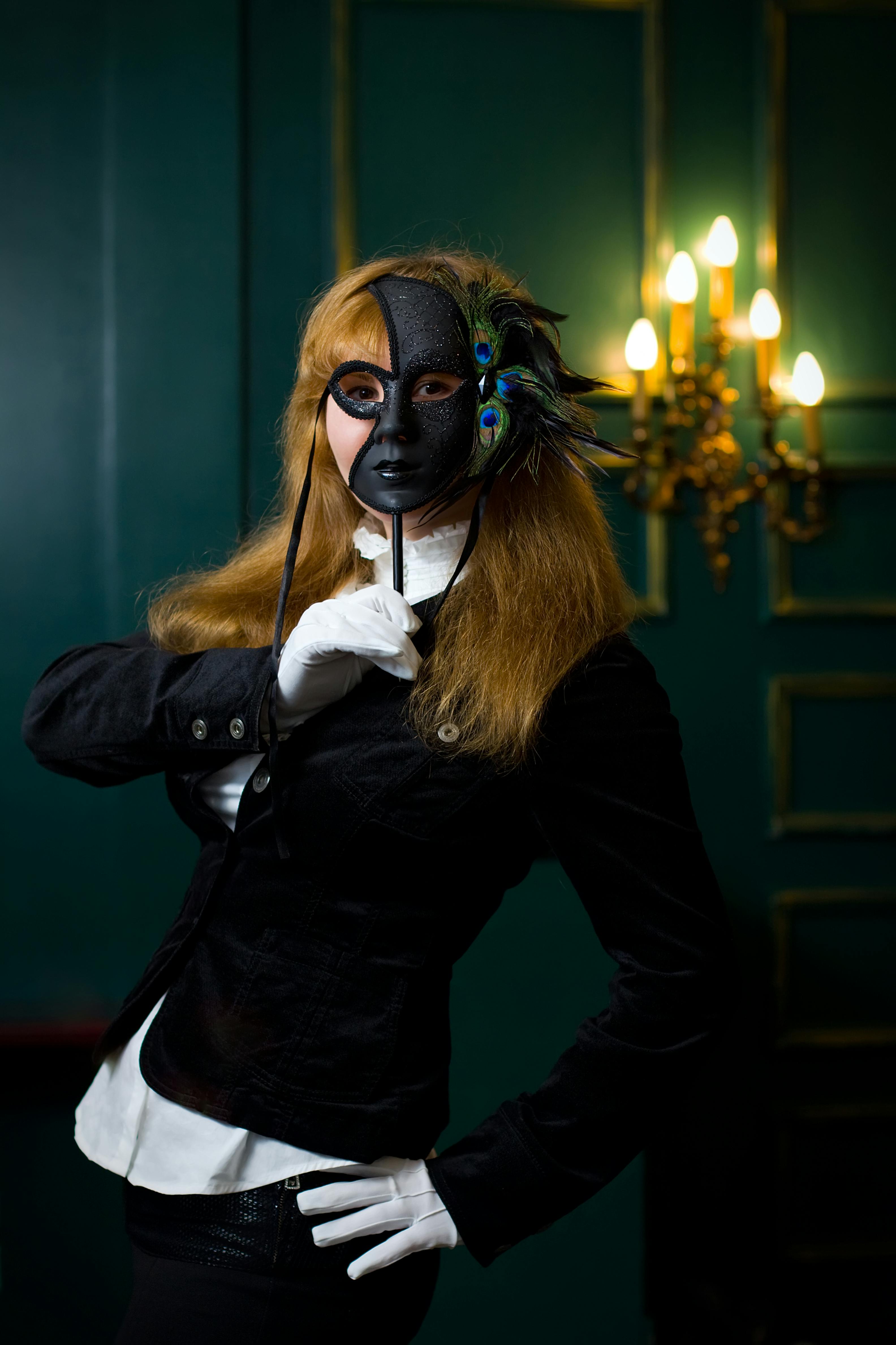 A Woman in Black Jacket Wearing Black Masquerade Mask · Free Stock Photo