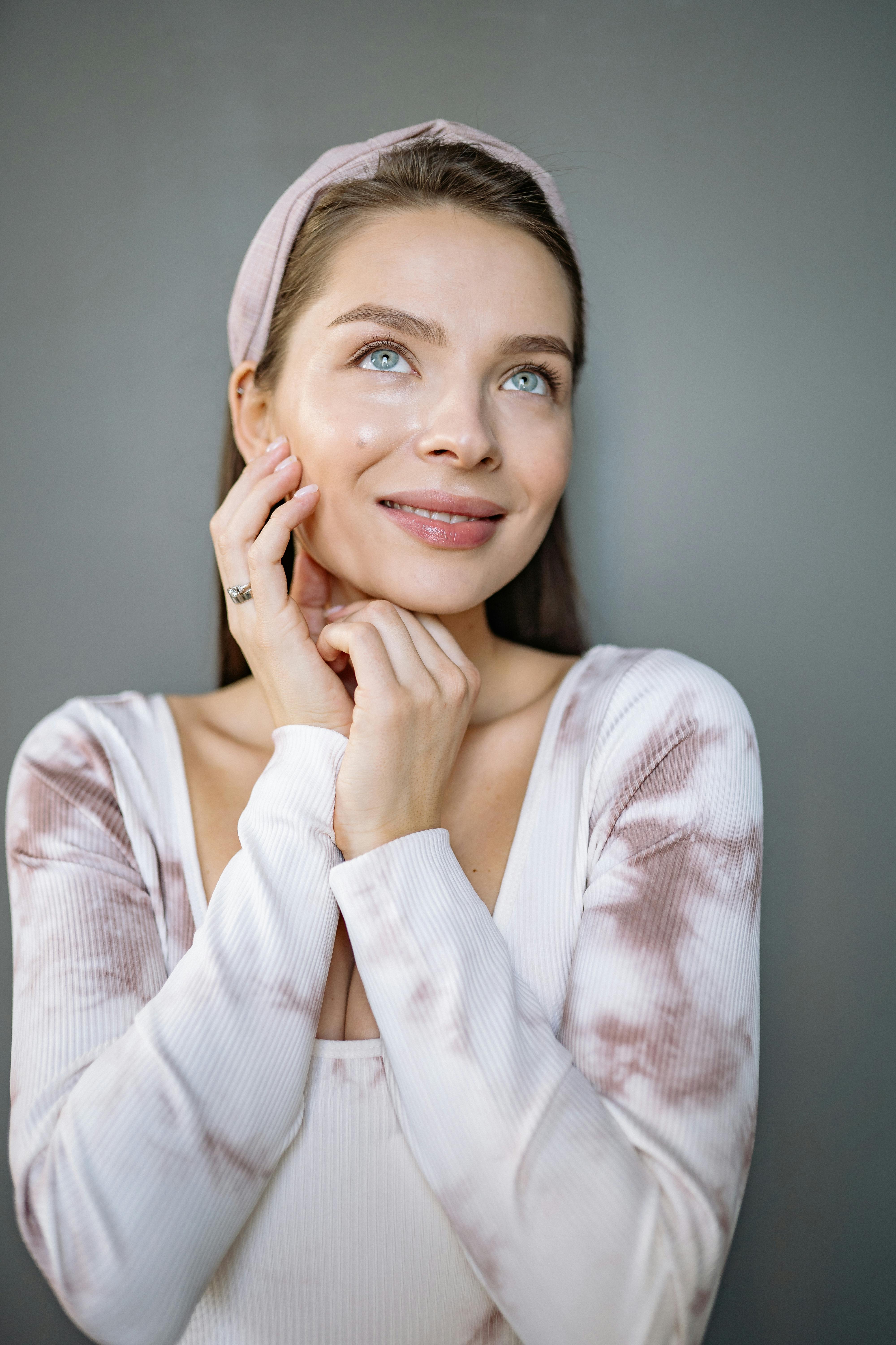 A Woman Posing While Looking Up · Free Stock Photo