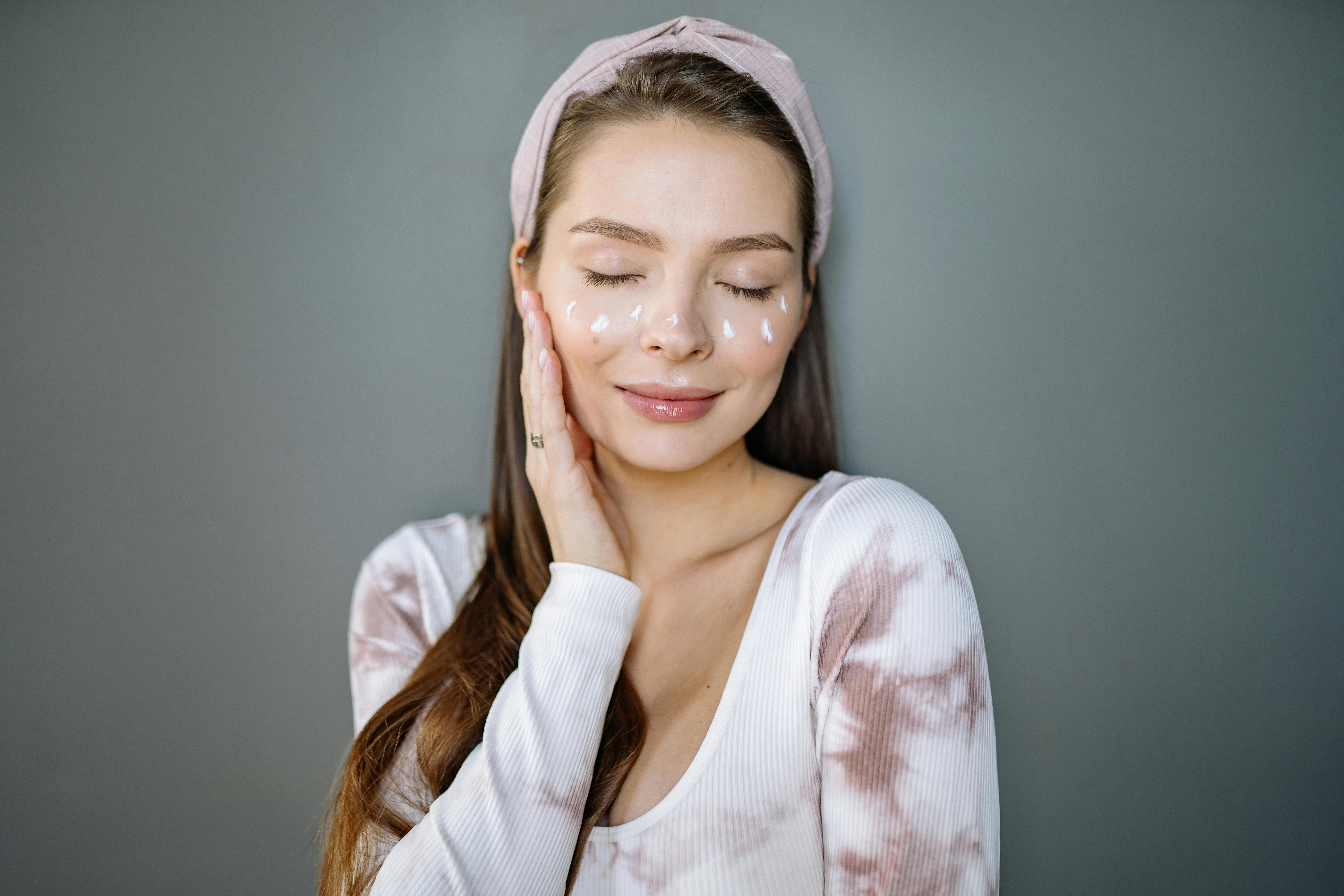 A Woman with Her Hand on Her Cheek · Free Stock Photo