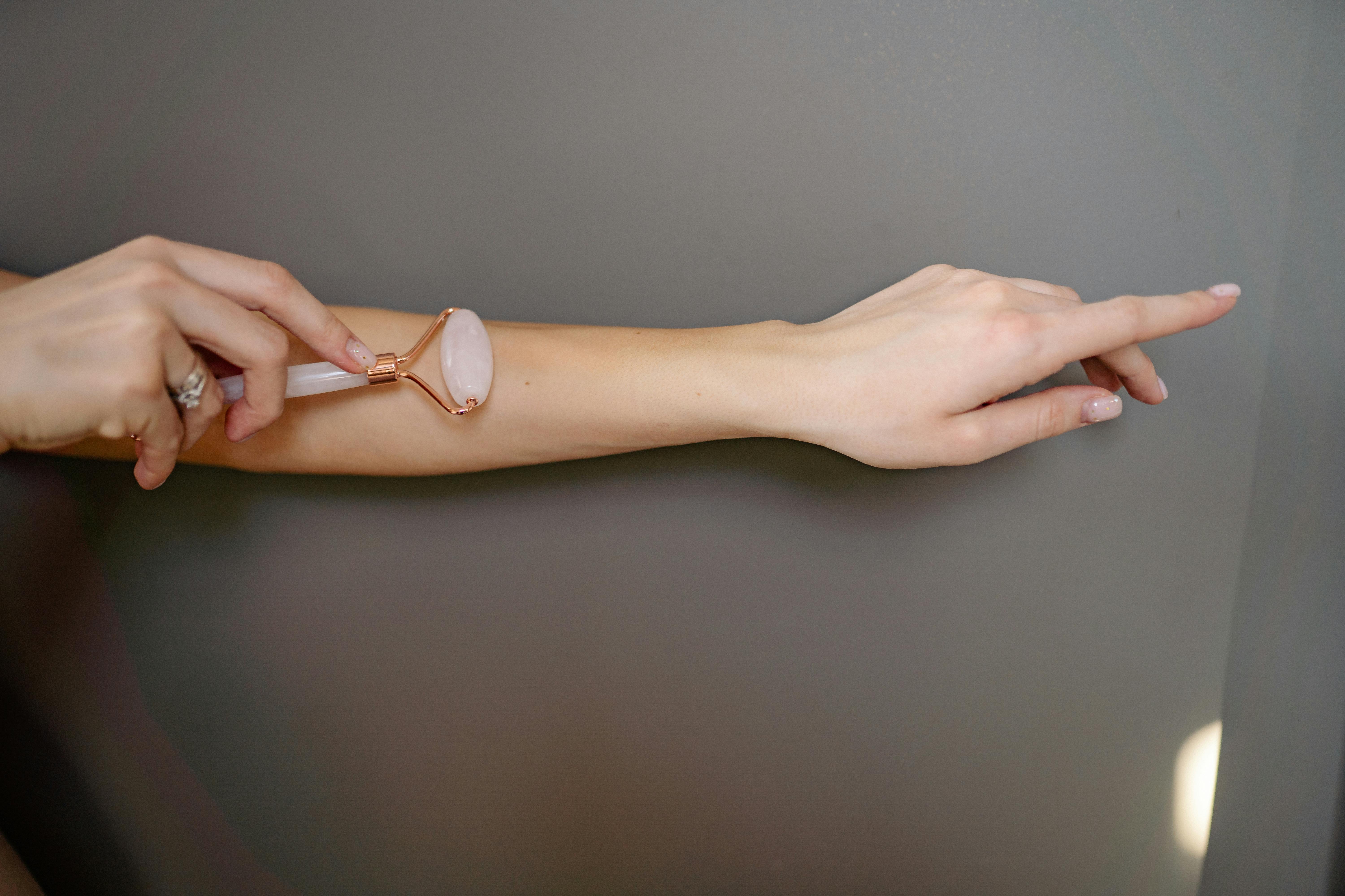 Woman Holding a Piece of Jade Stone on to Her Face · Free Stock Photo