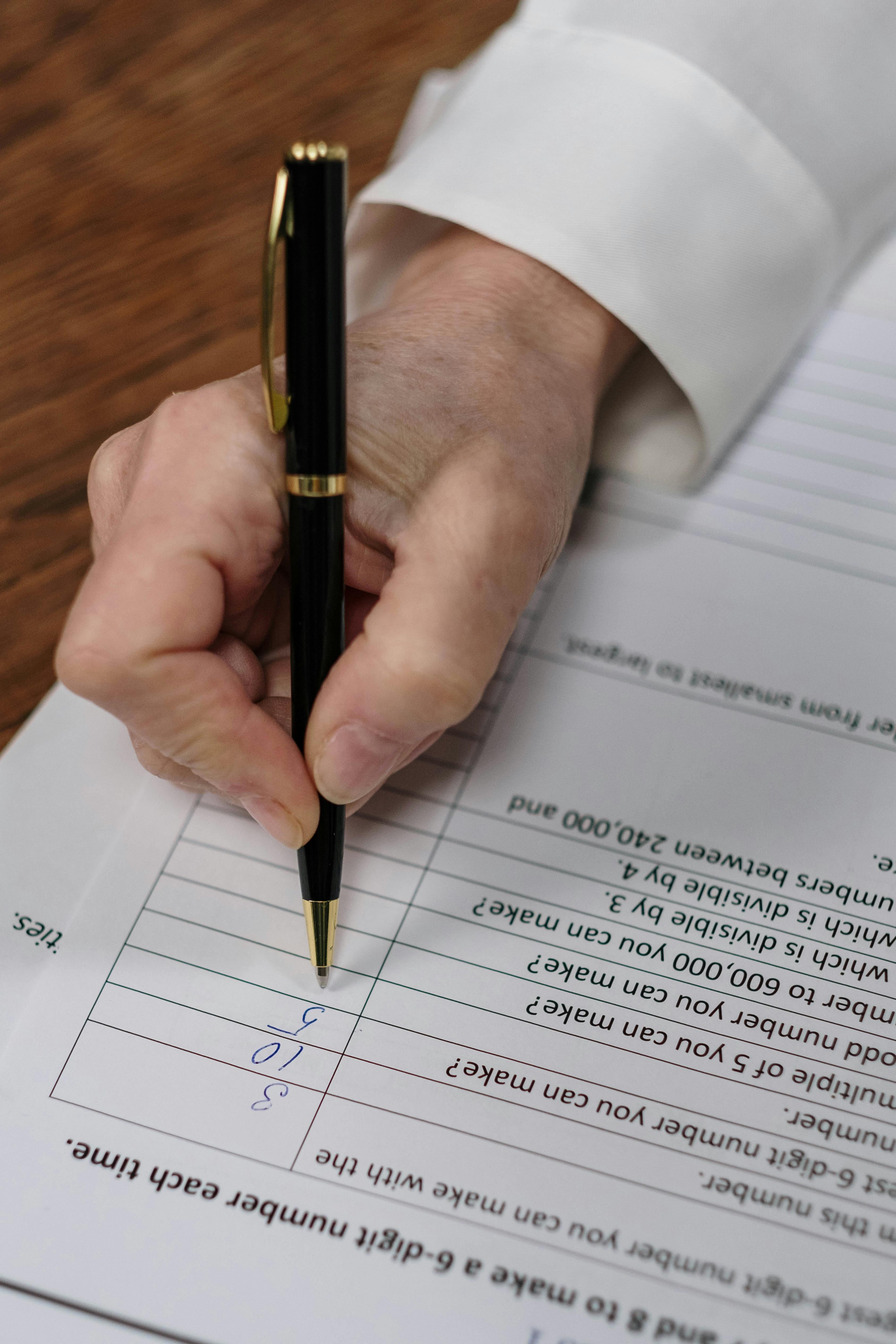 Person Checking Test Papers · Free Stock Photo