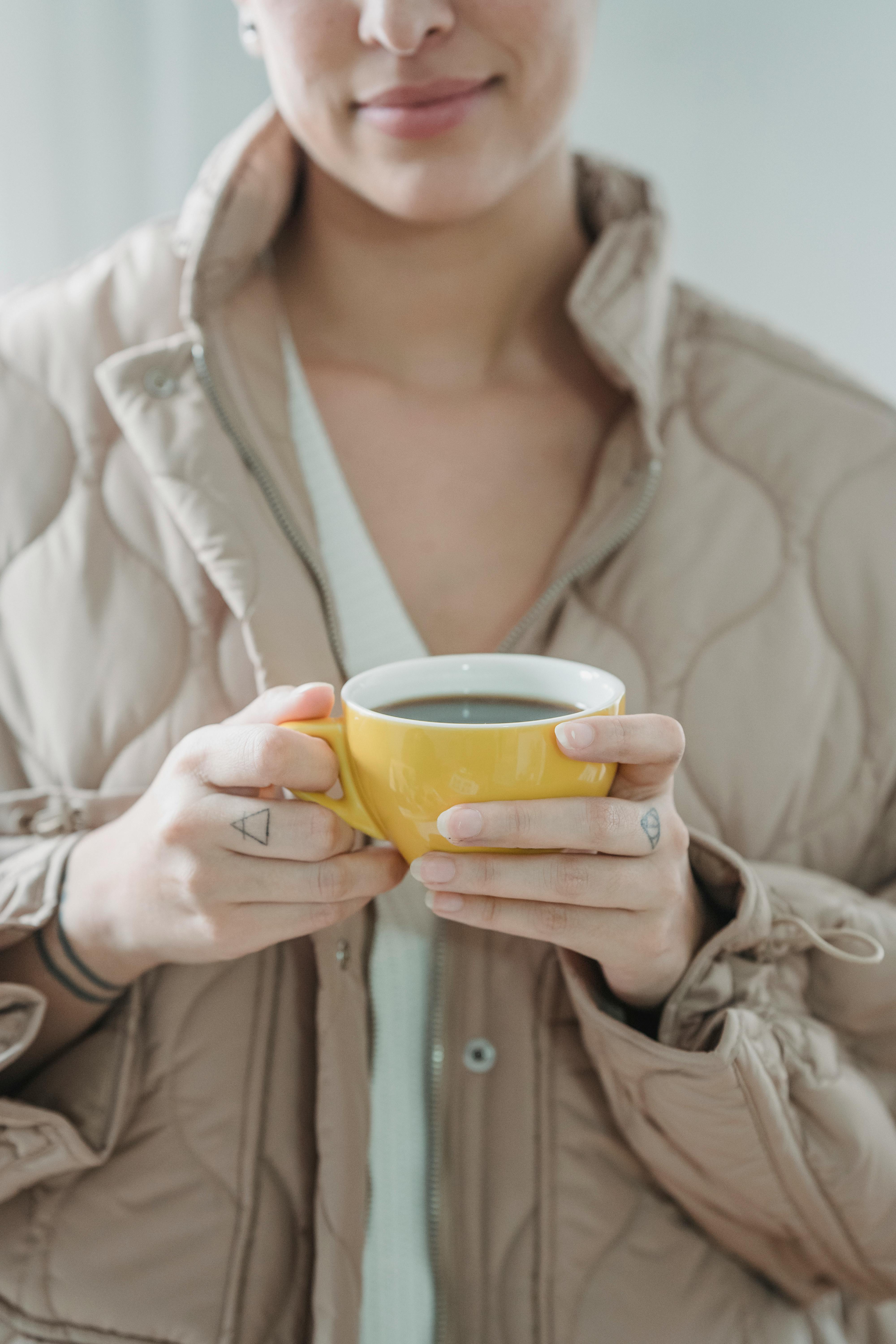 Yellow Mug held by a Person · Free Stock Photo