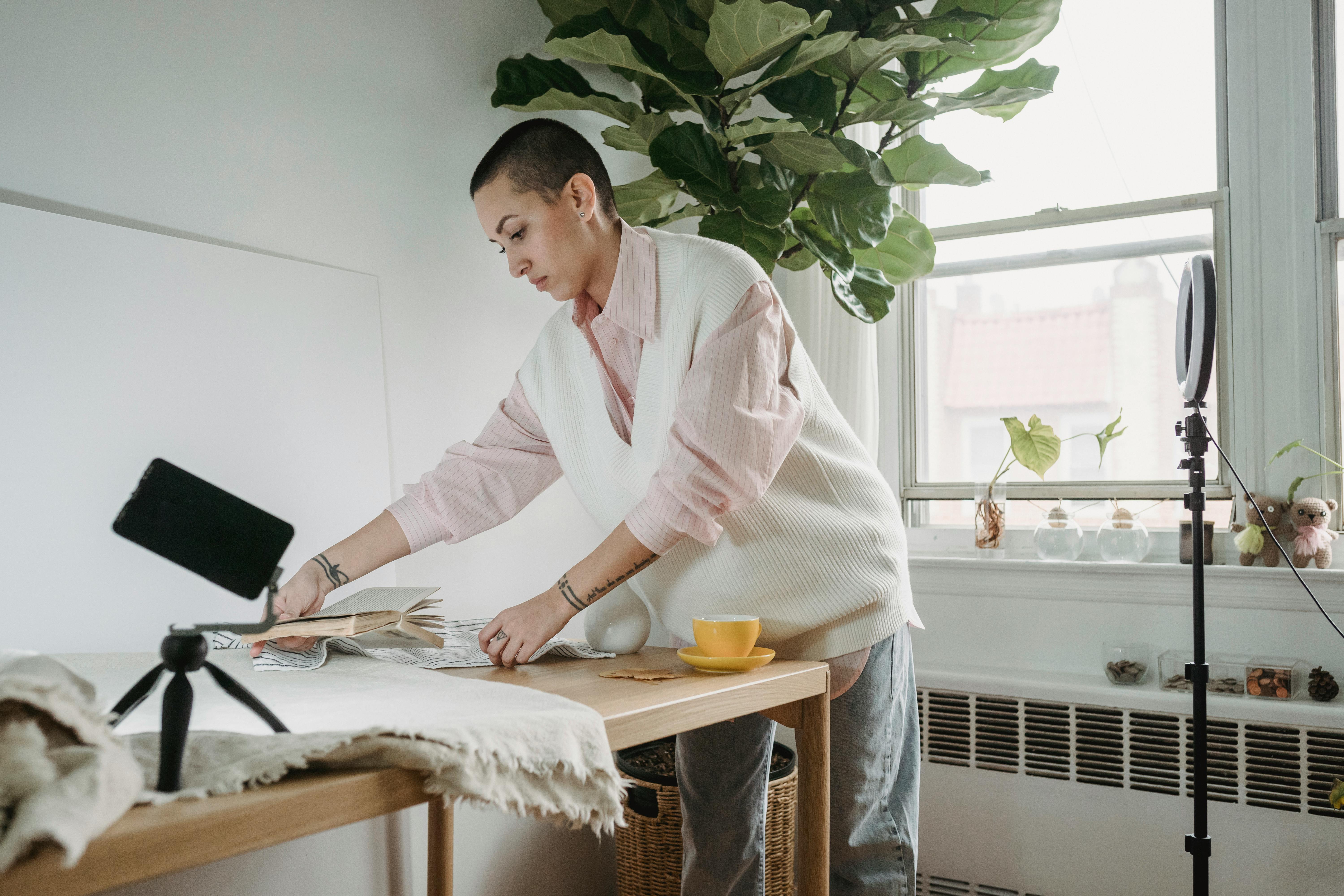 Woman placing paper in printer for making photos · Free Stock Photo