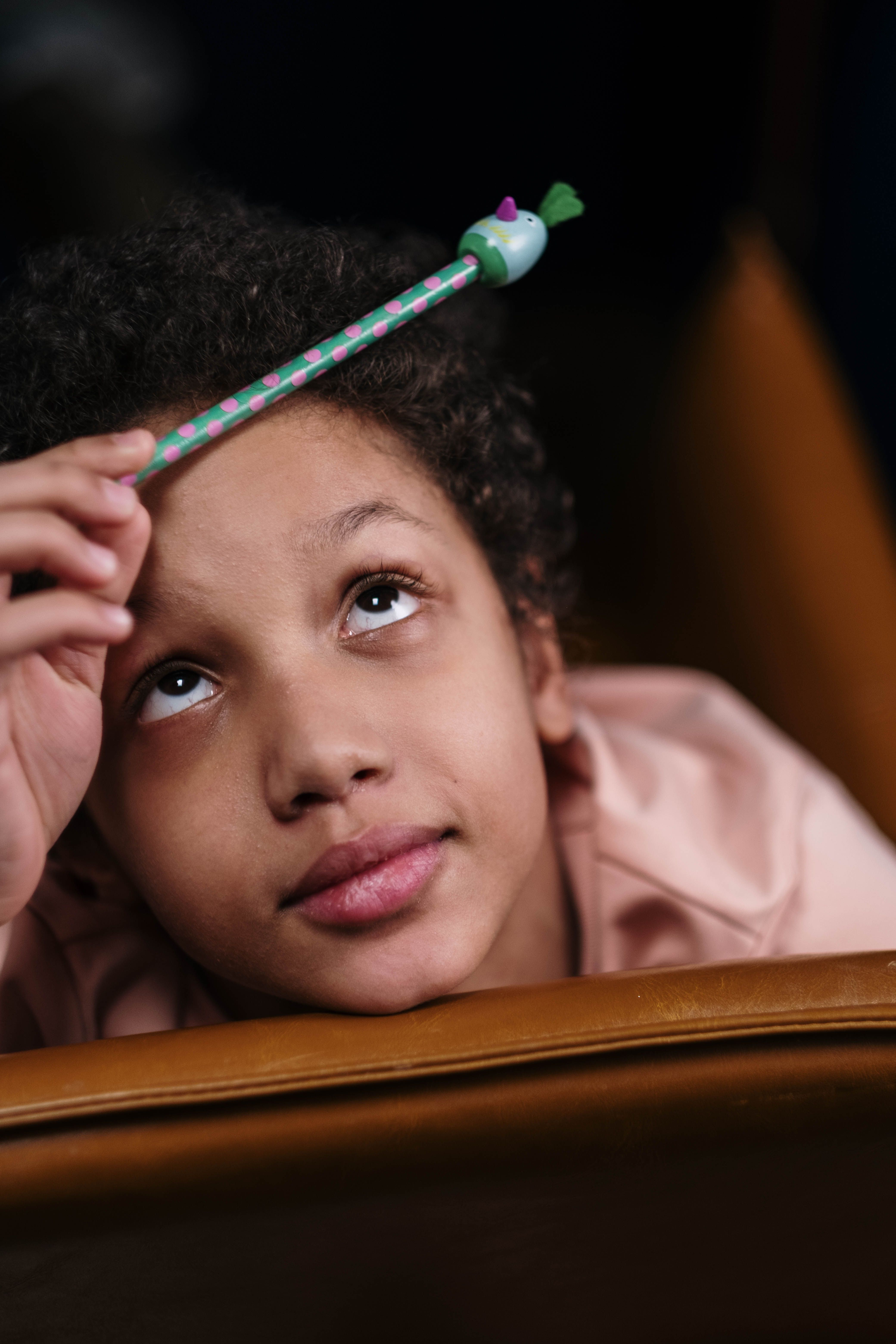 Boy Holding a Green and Pink Pen · Free Stock Photo