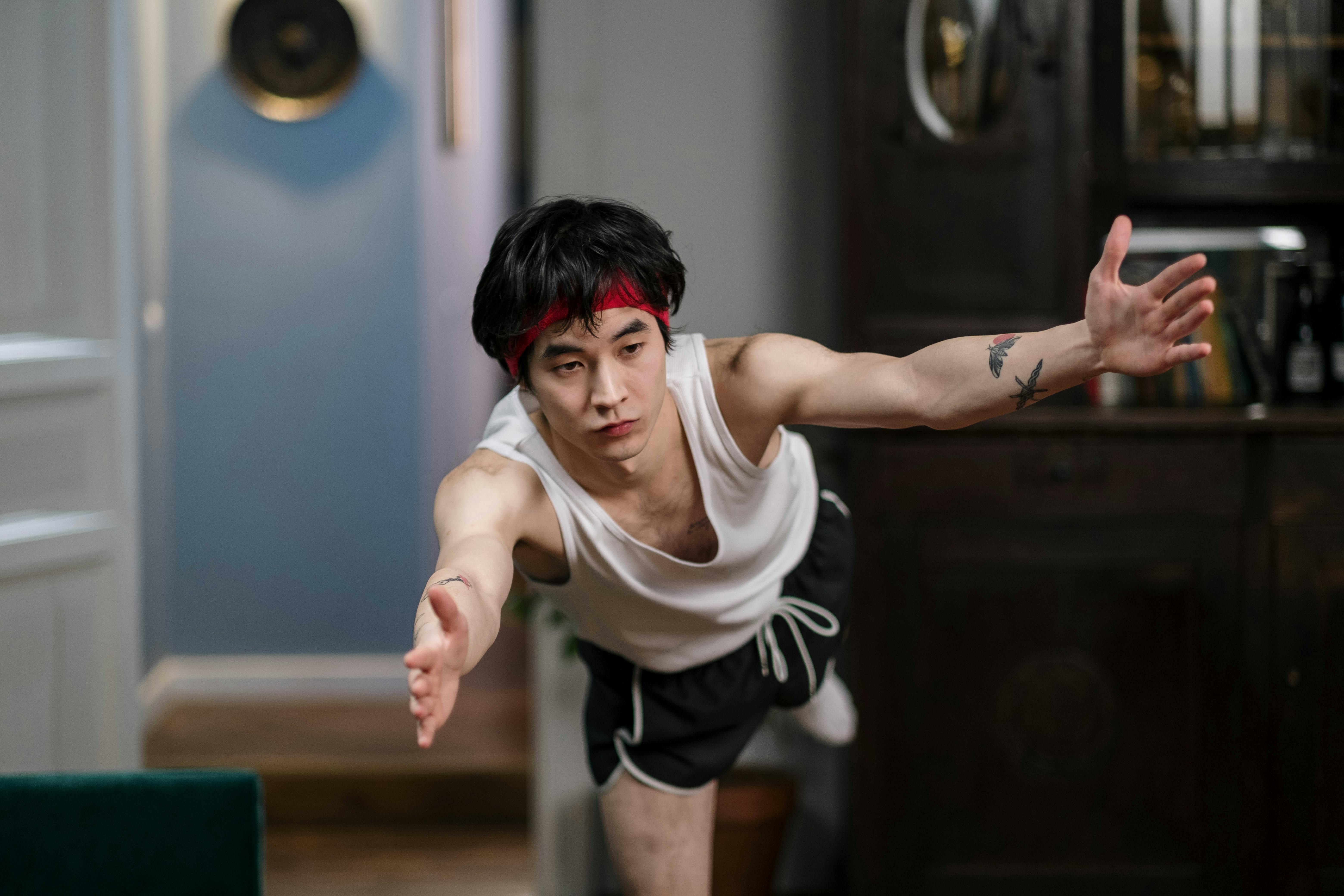 Shallow Focus Photo of Man Exercising at Home · Free Stock Photo