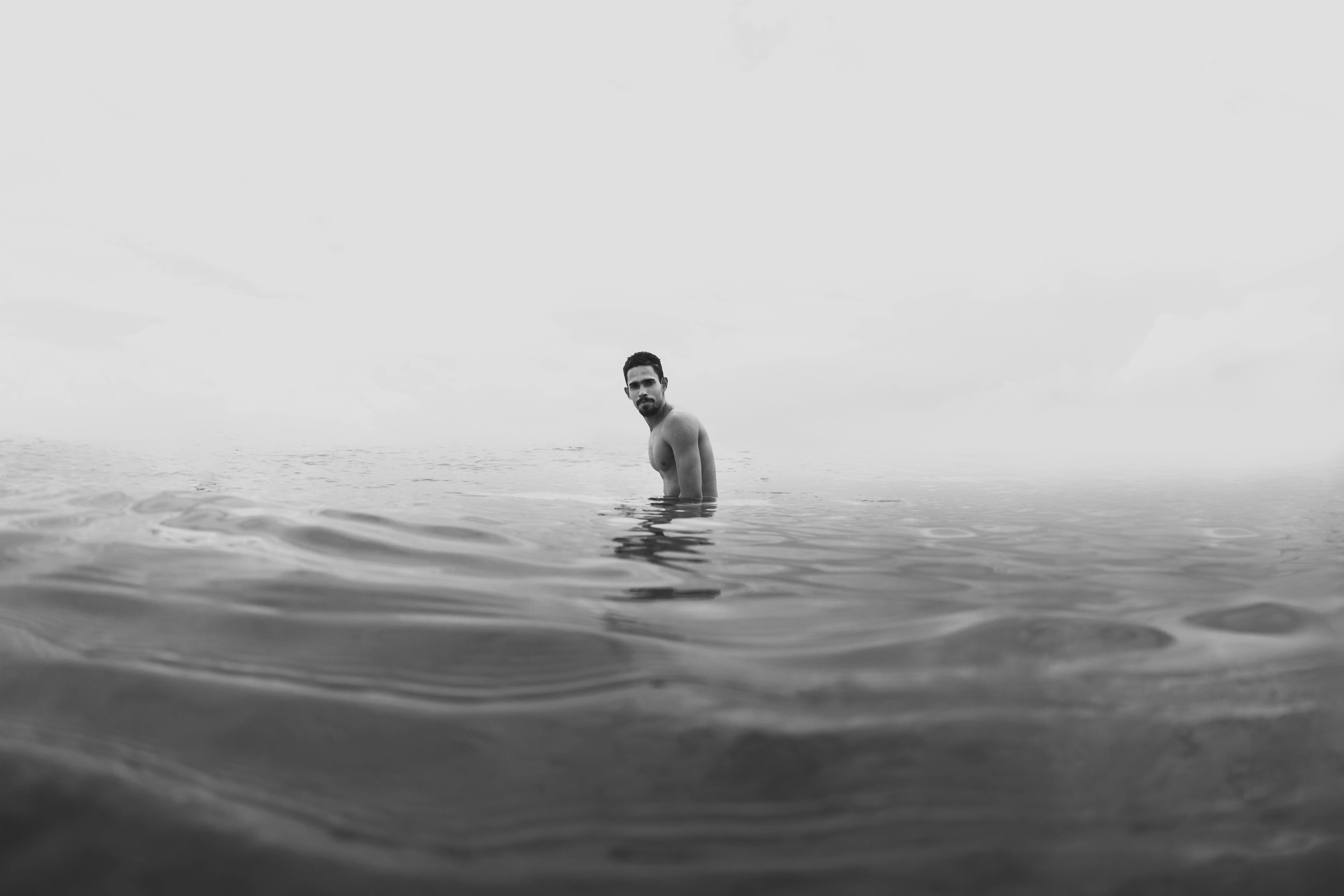 Black and White Photo of a Man Diving · Free Stock Photo