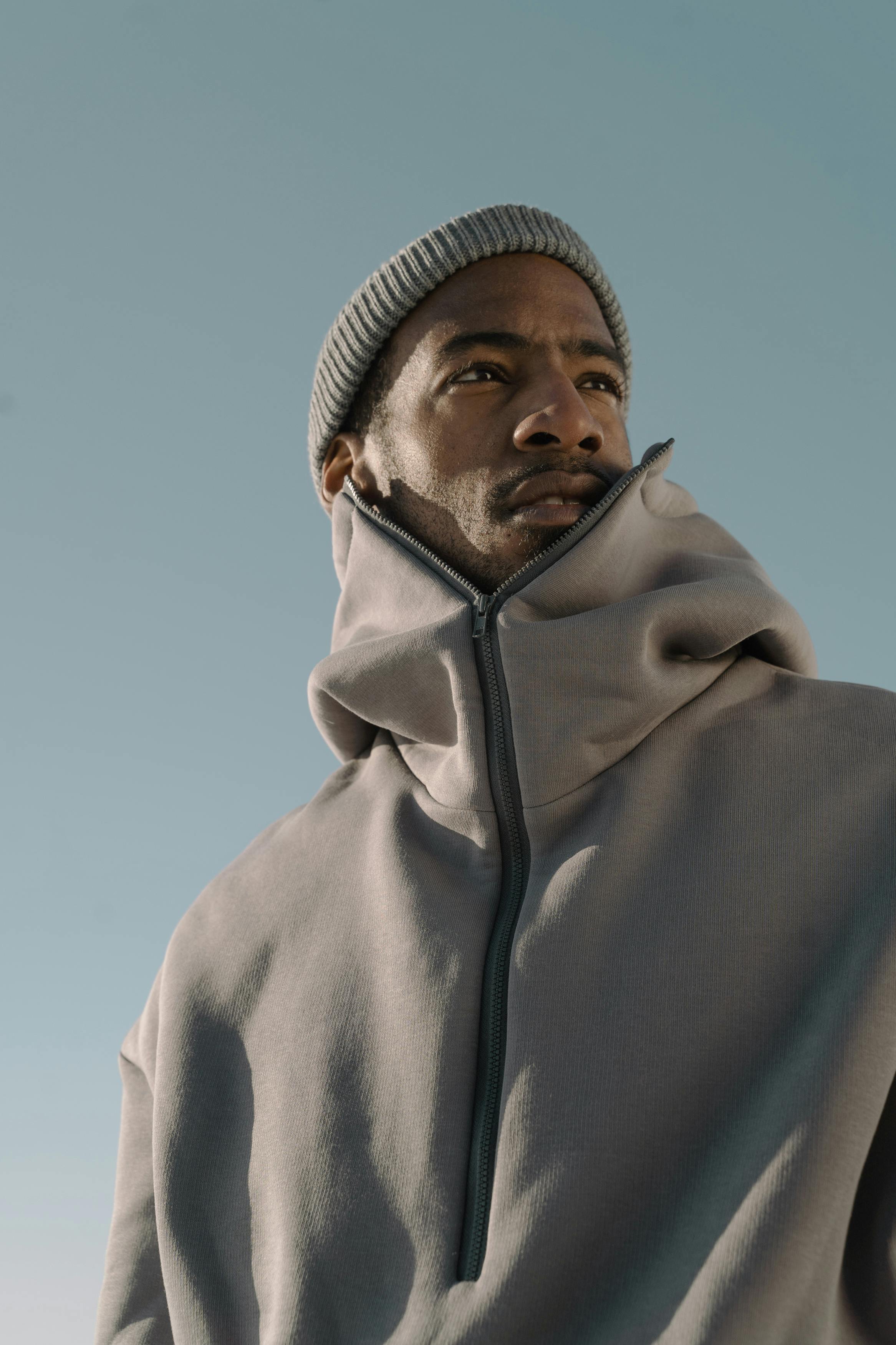 Low-Angle Shot of a Man in Streetwear Clothes · Free Stock Photo