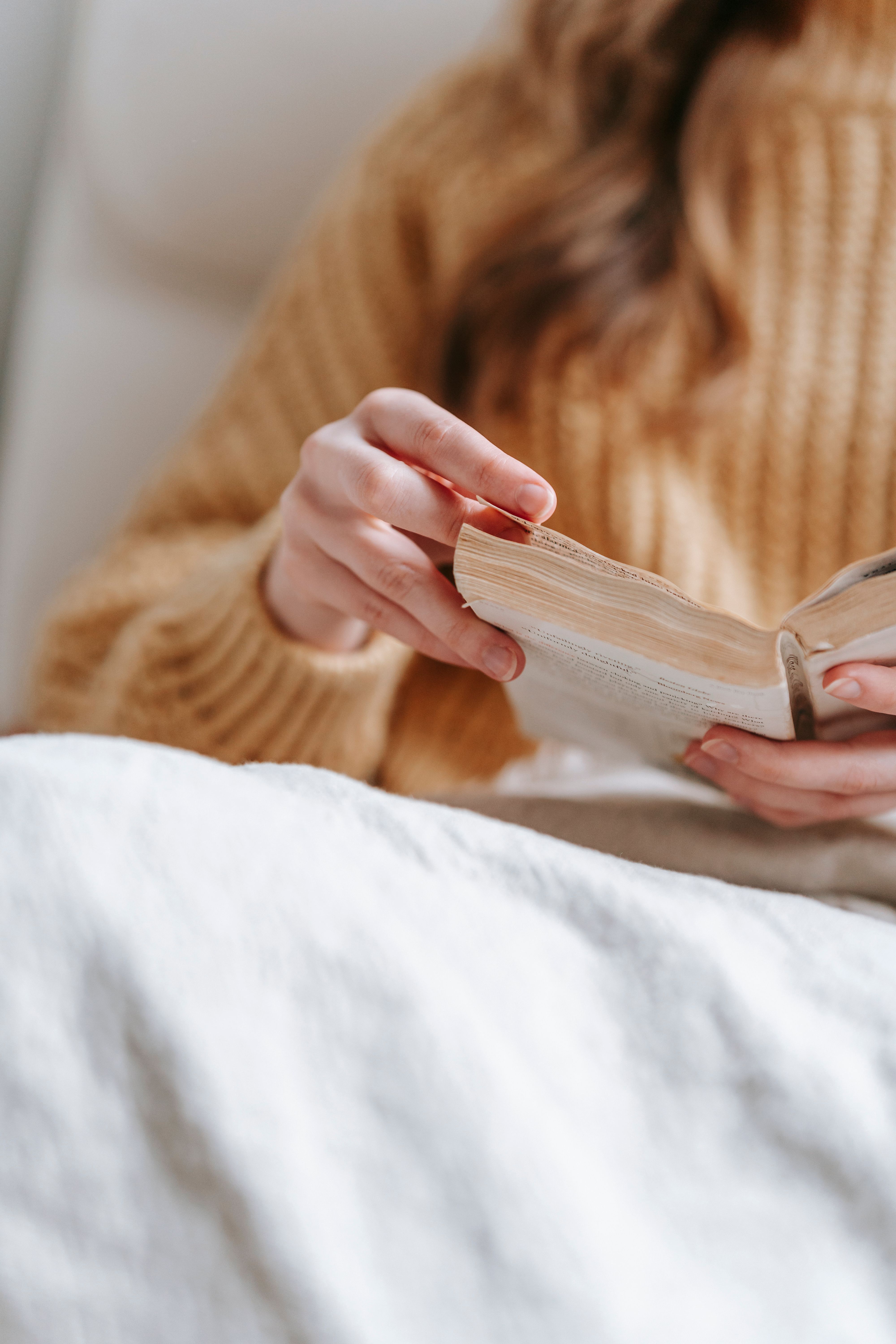 Close Up Photo of Person Reading Book · Free Stock Photo