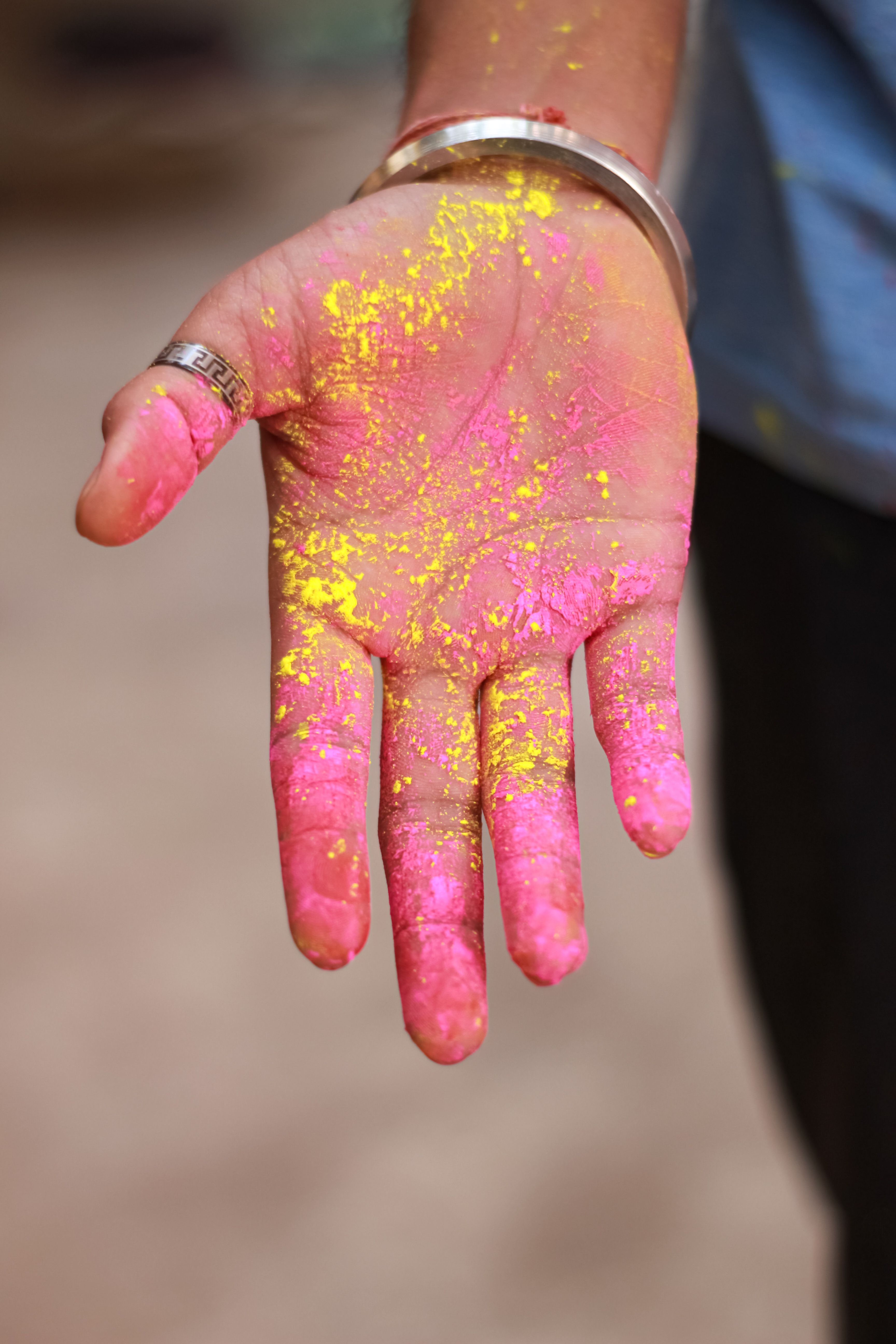Person With Red and Yellow Paint on Hand · Free Stock Photo
