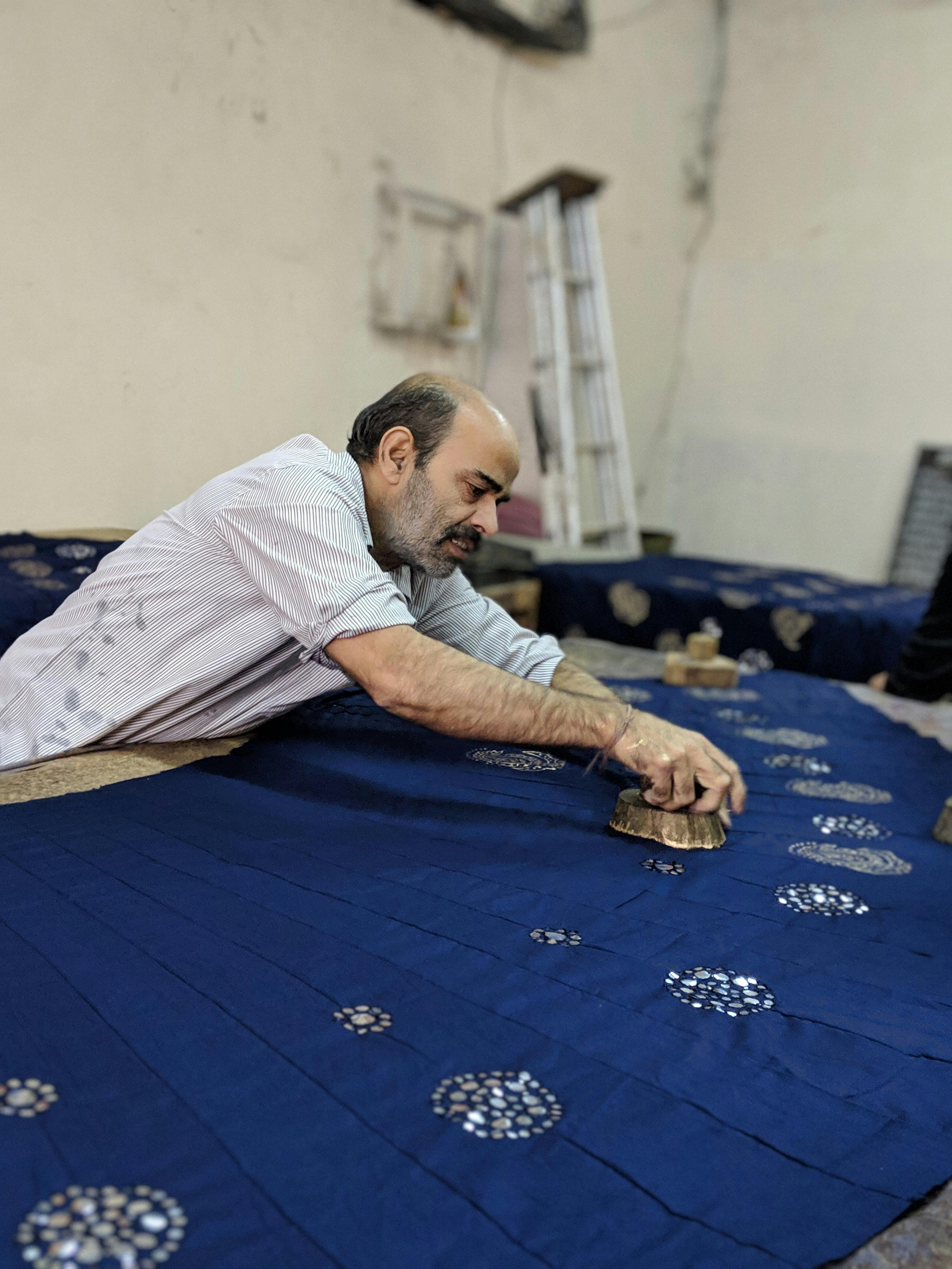 Elderly Man Cleaning Blue Rug · Free Stock Photo
