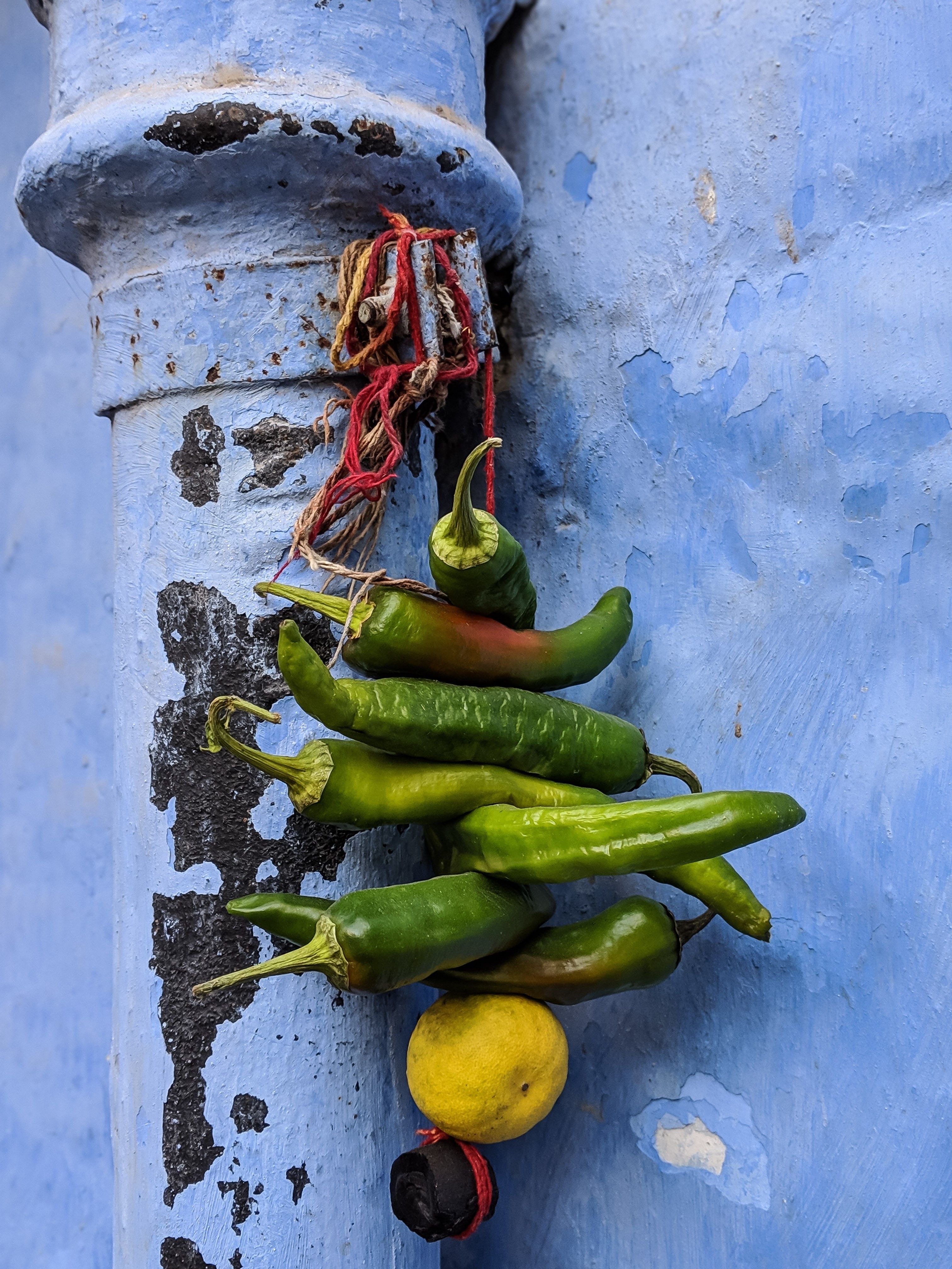 Green Chili Peppers Near a Blue Surface · Free Stock Photo