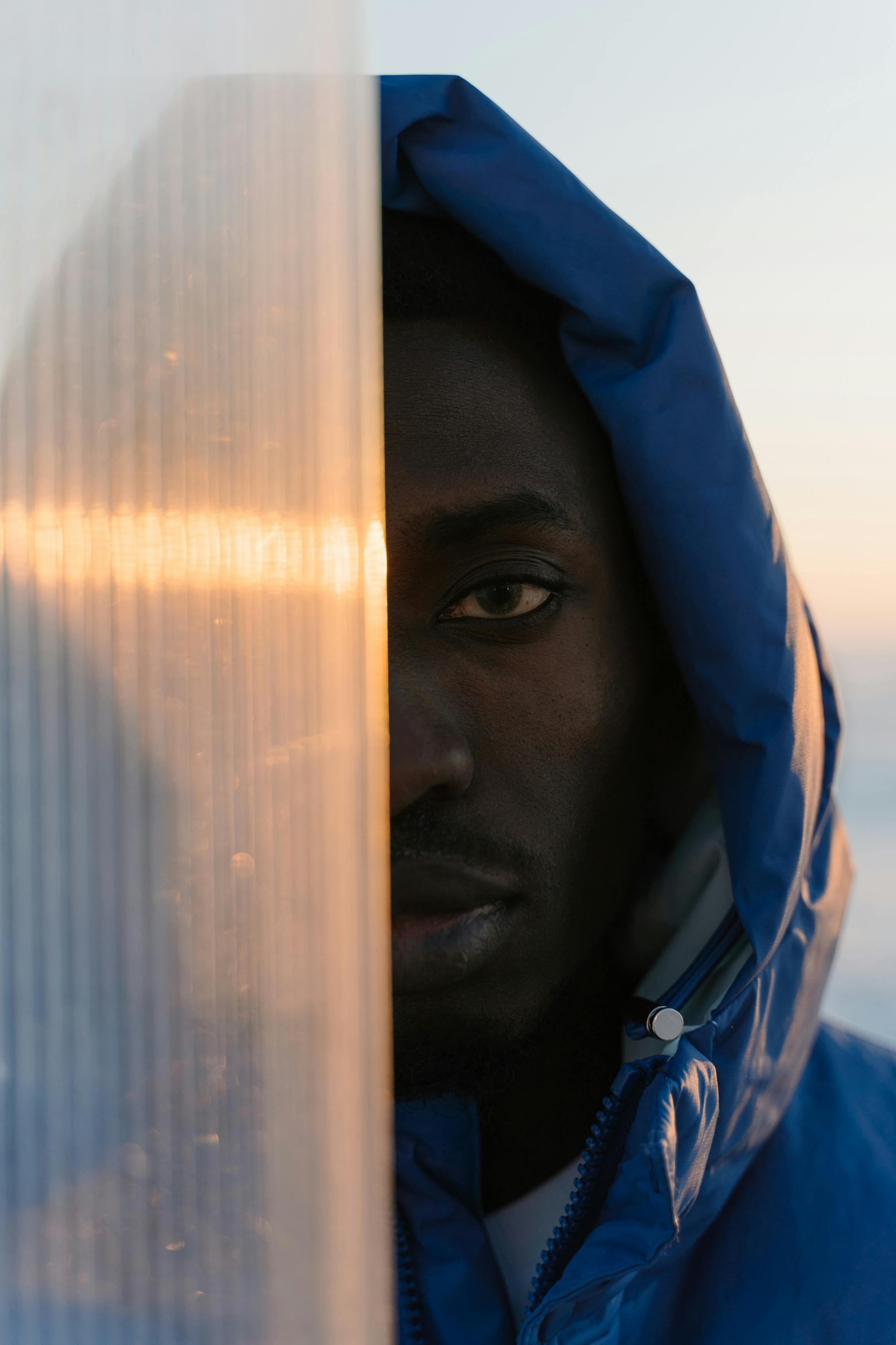 Glass Wall Covering the Man's Half Face · Free Stock Photo