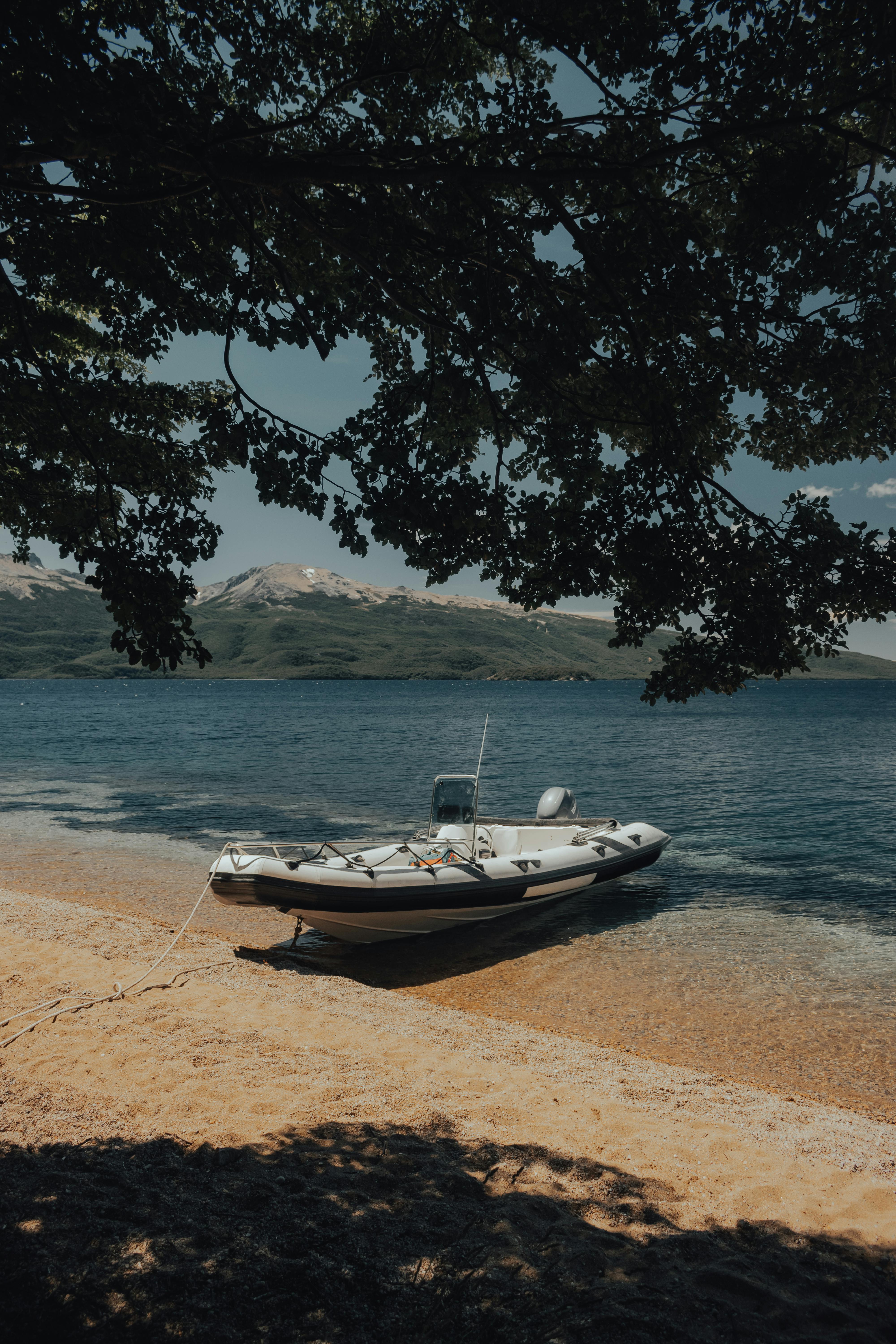 A Speed Boat Moored on the Beach · Free Stock Photo