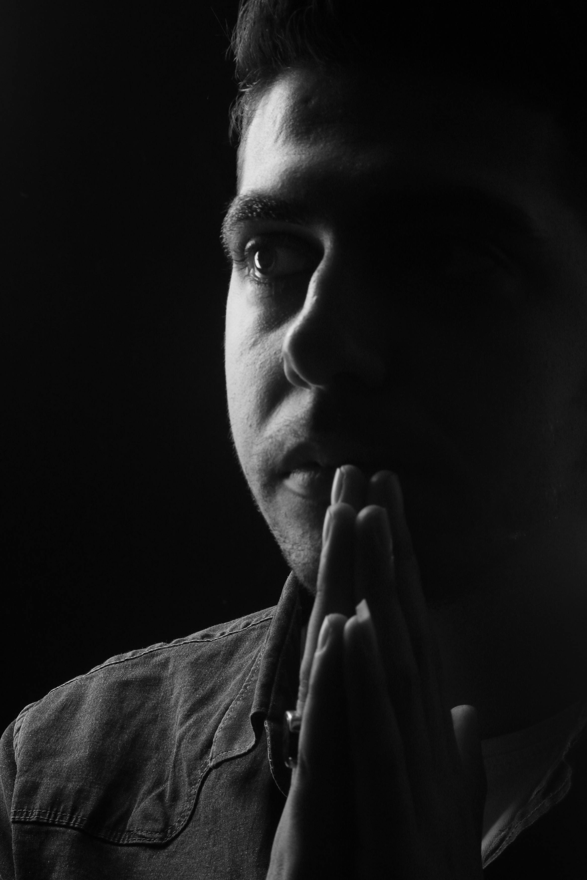 Grayscale Photo of Man Grabbing Using Right Hand · Free Stock Photo