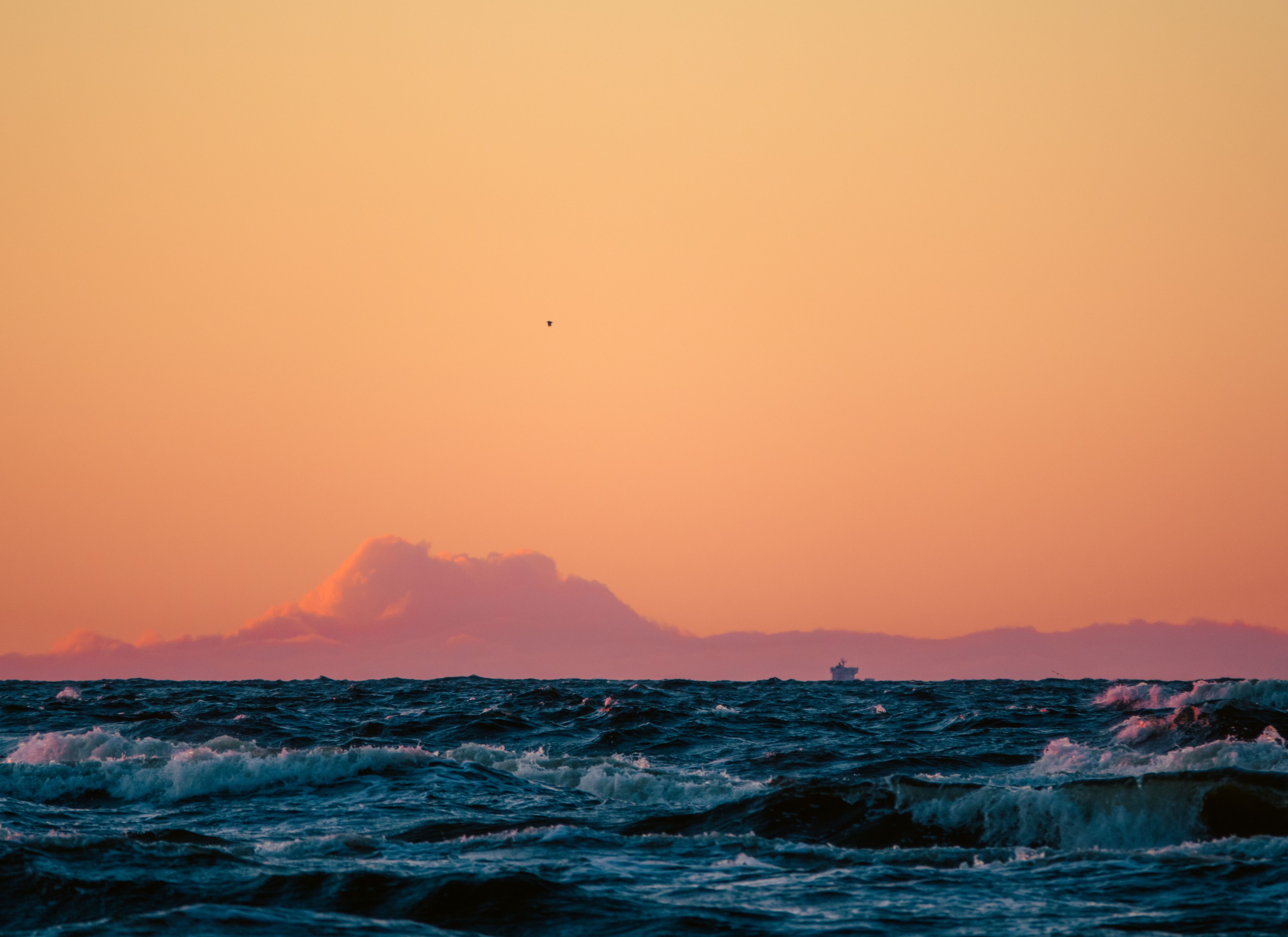 Ocean Water Waves over Orange Sky · Free Stock Photo