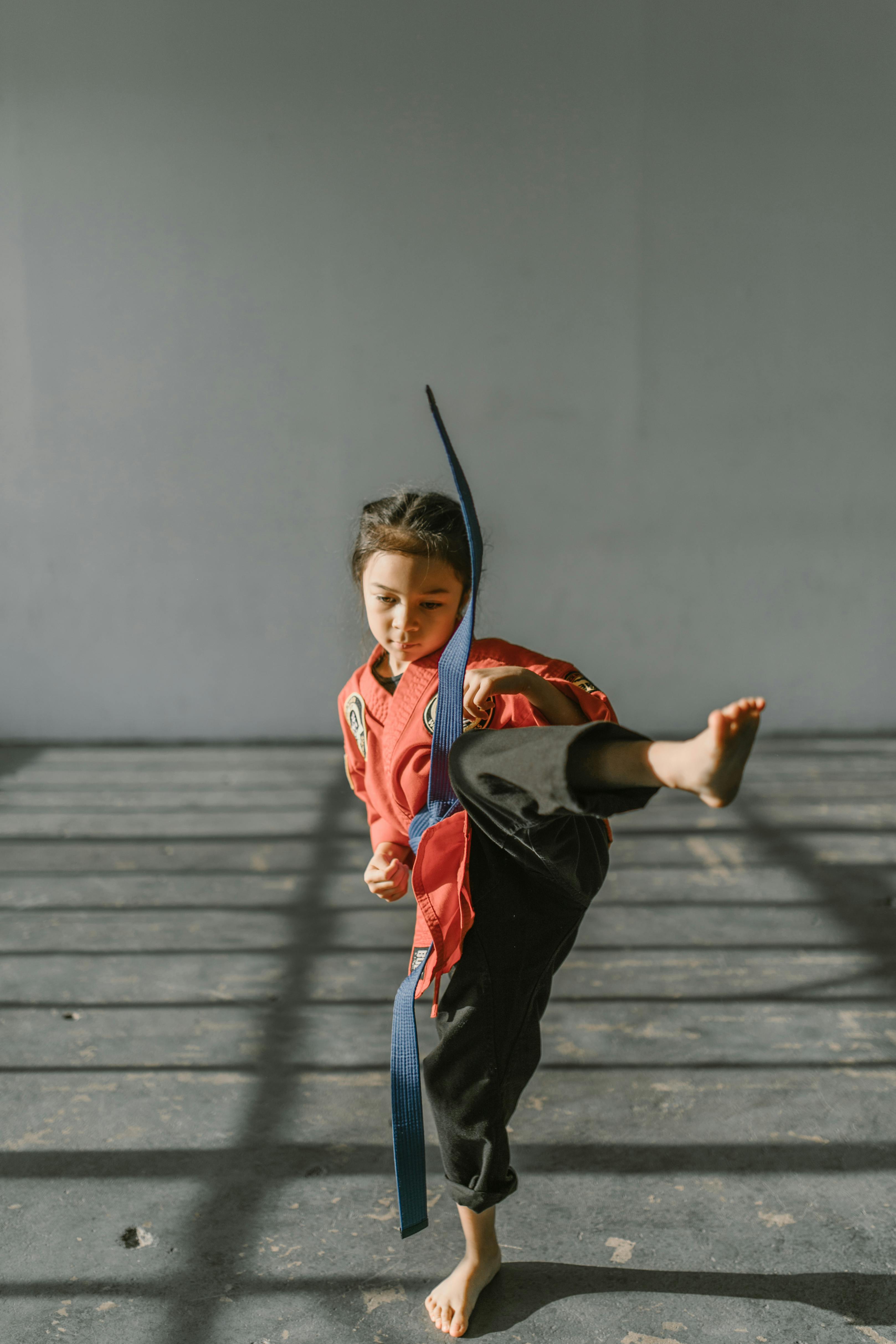 Girl Wearing Red Dobok and Blue Belt · Free Stock Photo
