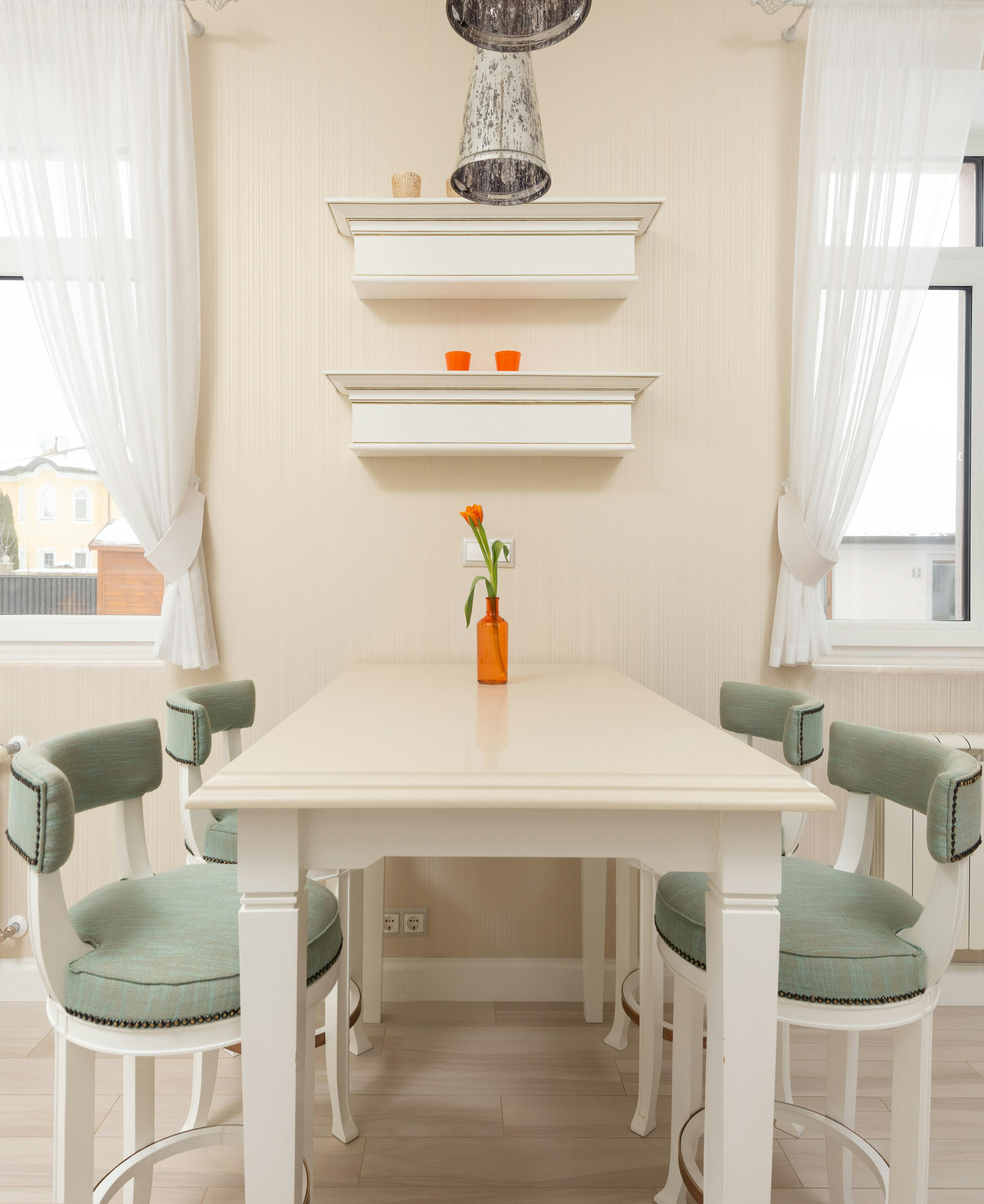 Round Brown Wooden Table Between Two Chairs and Ottoman Chair · Free ...