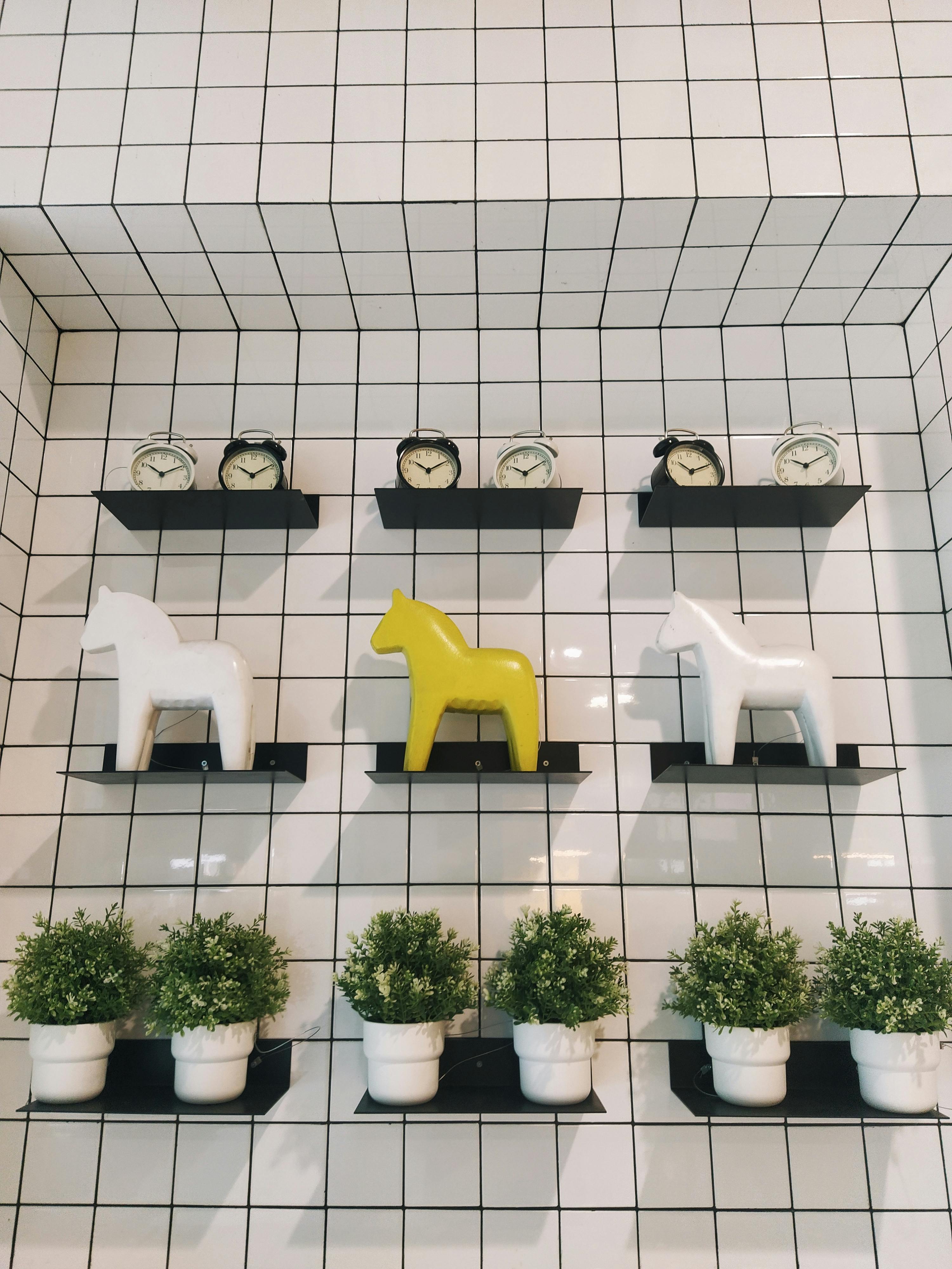 Tile Wall with Plants, Horse Toys and Alarm Clocks on Shelves · Free ...