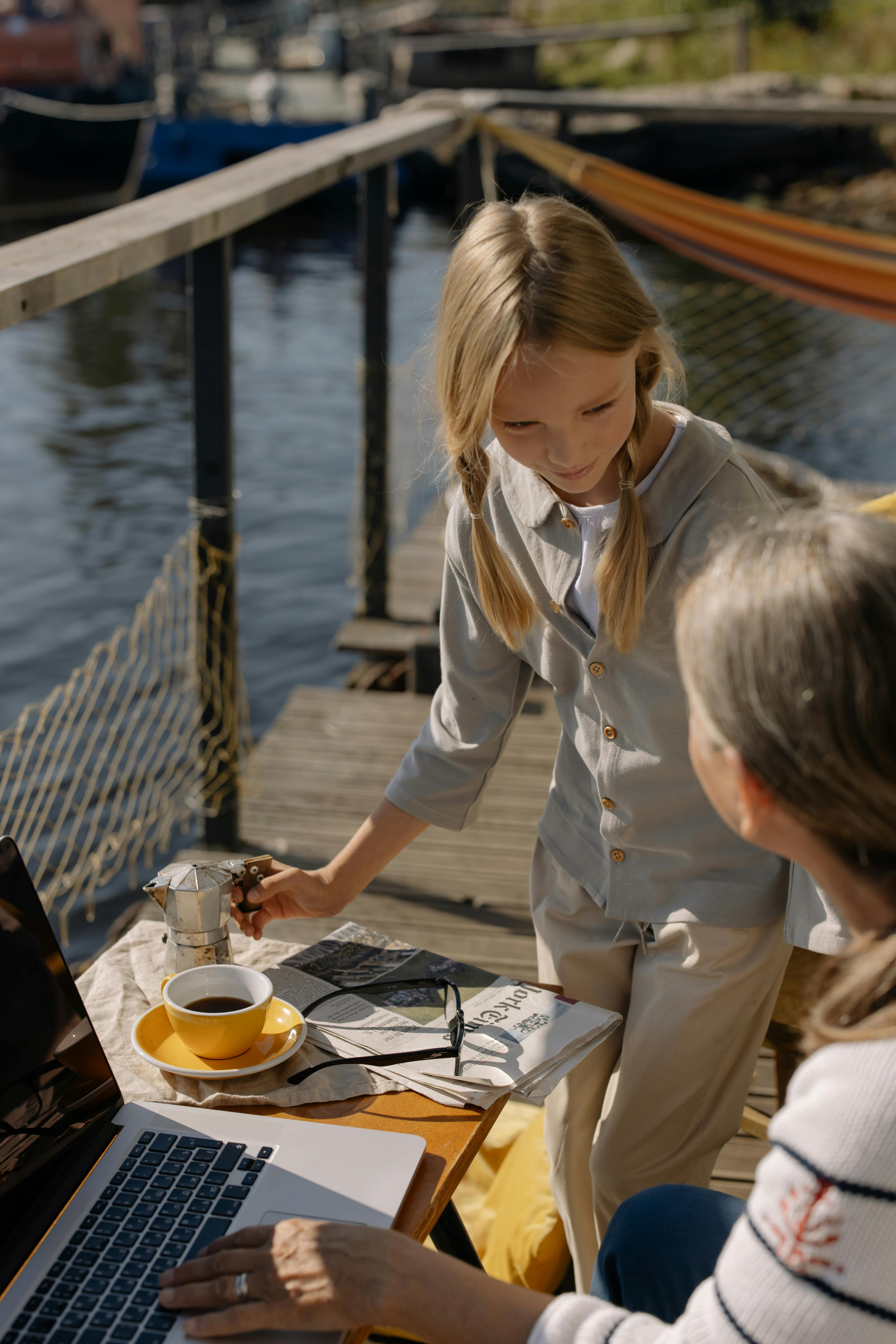 A Girl Serving a Woman Coffee · Free Stock Photo