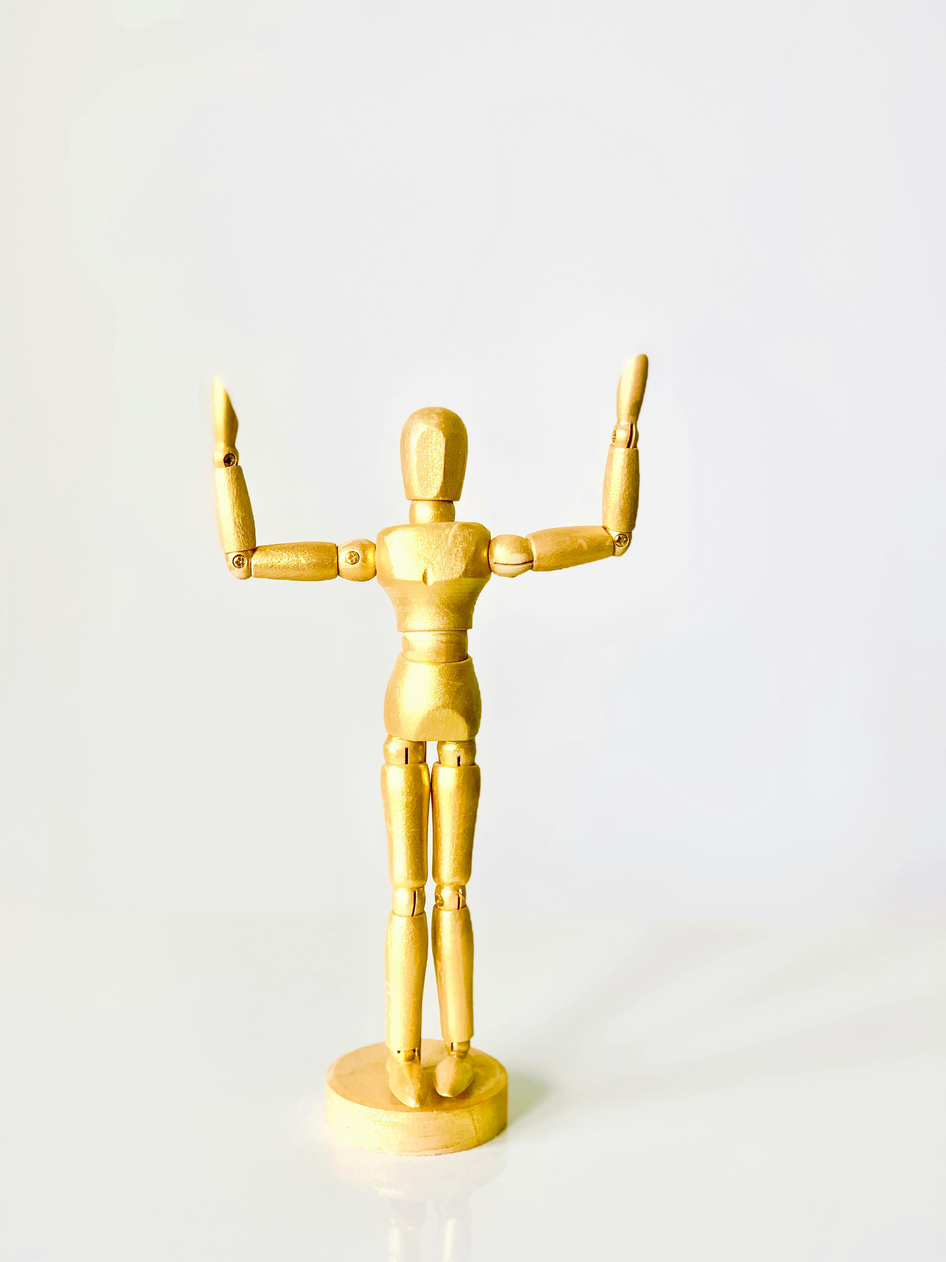 Figure of Human Body on White Sheet · Free Stock Photo