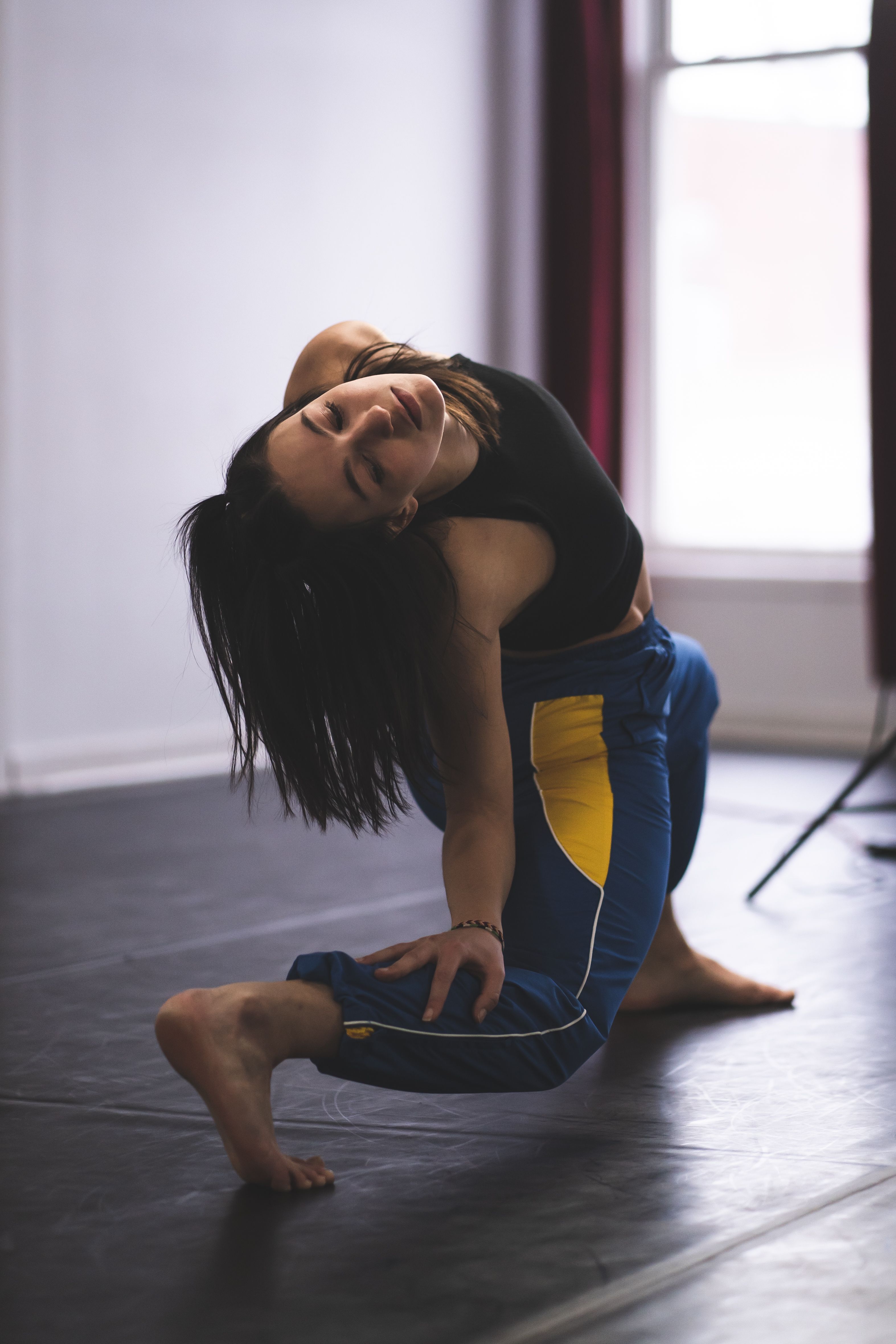 A Woman in Black Tank Top Dancing with Her Eyes Closed · Free Stock Photo