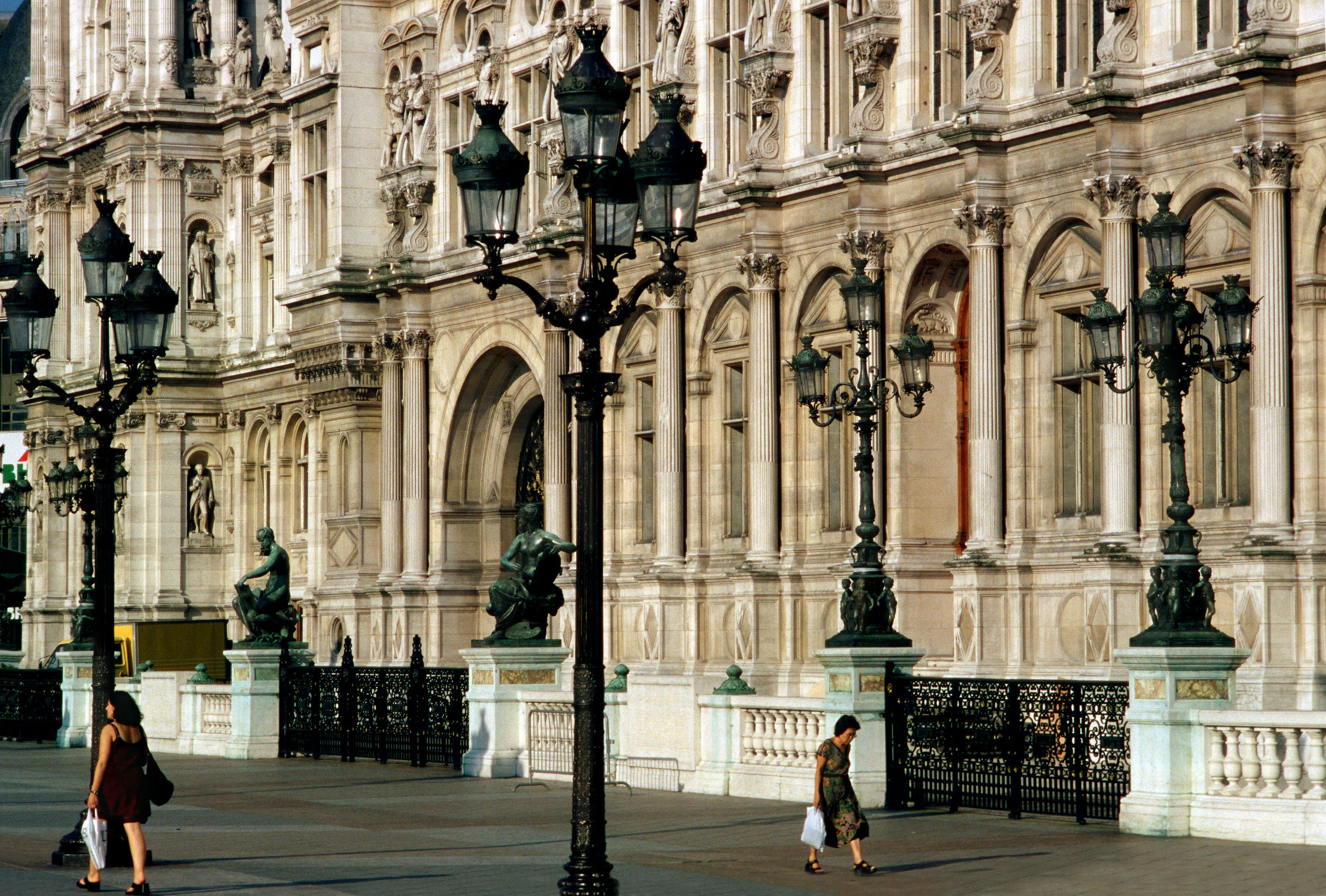 Women Walking in Front of a Grandiose Building · Free Stock Photo