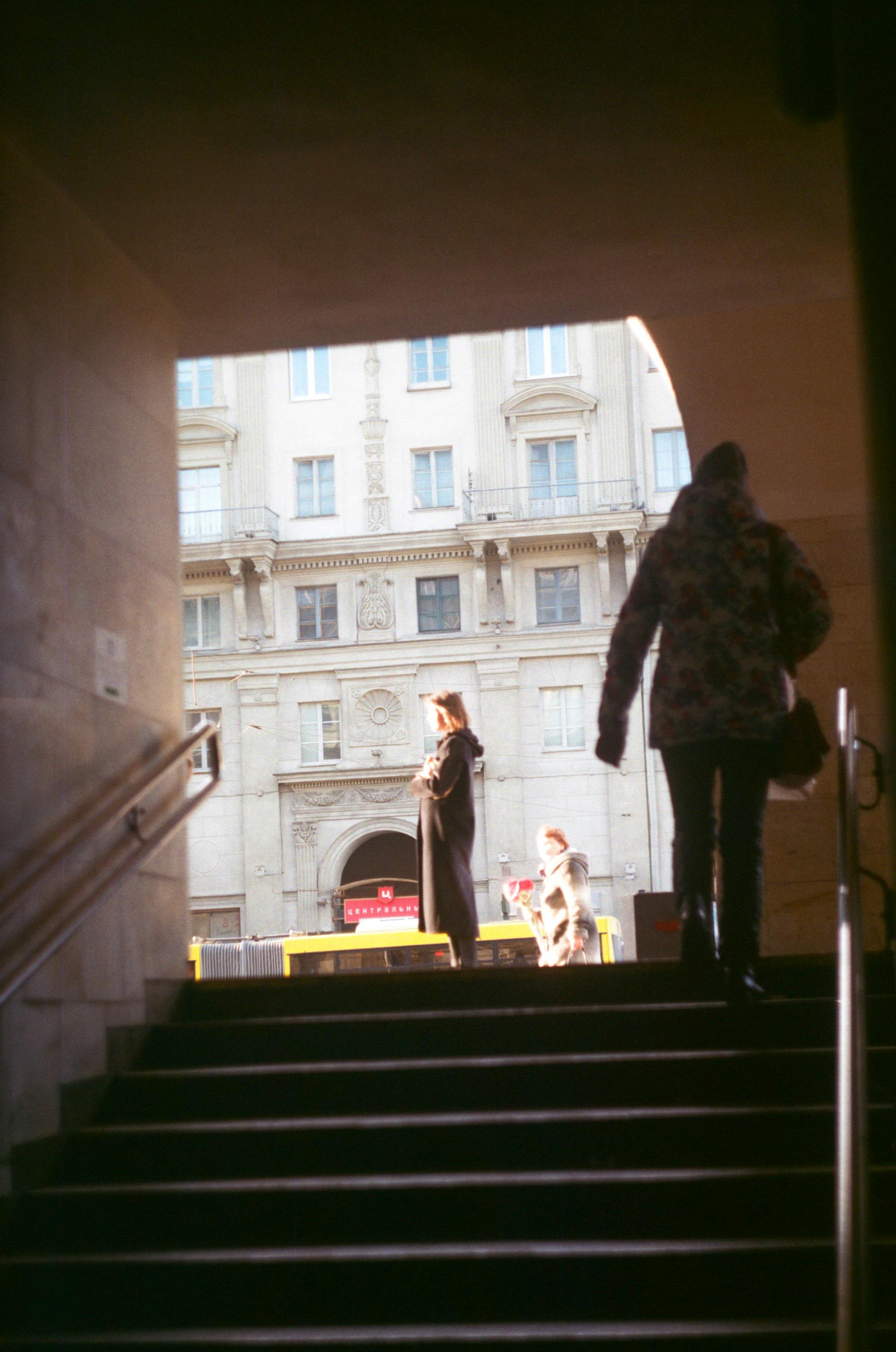 Woman Walking on Brown Stair · Free Stock Photo