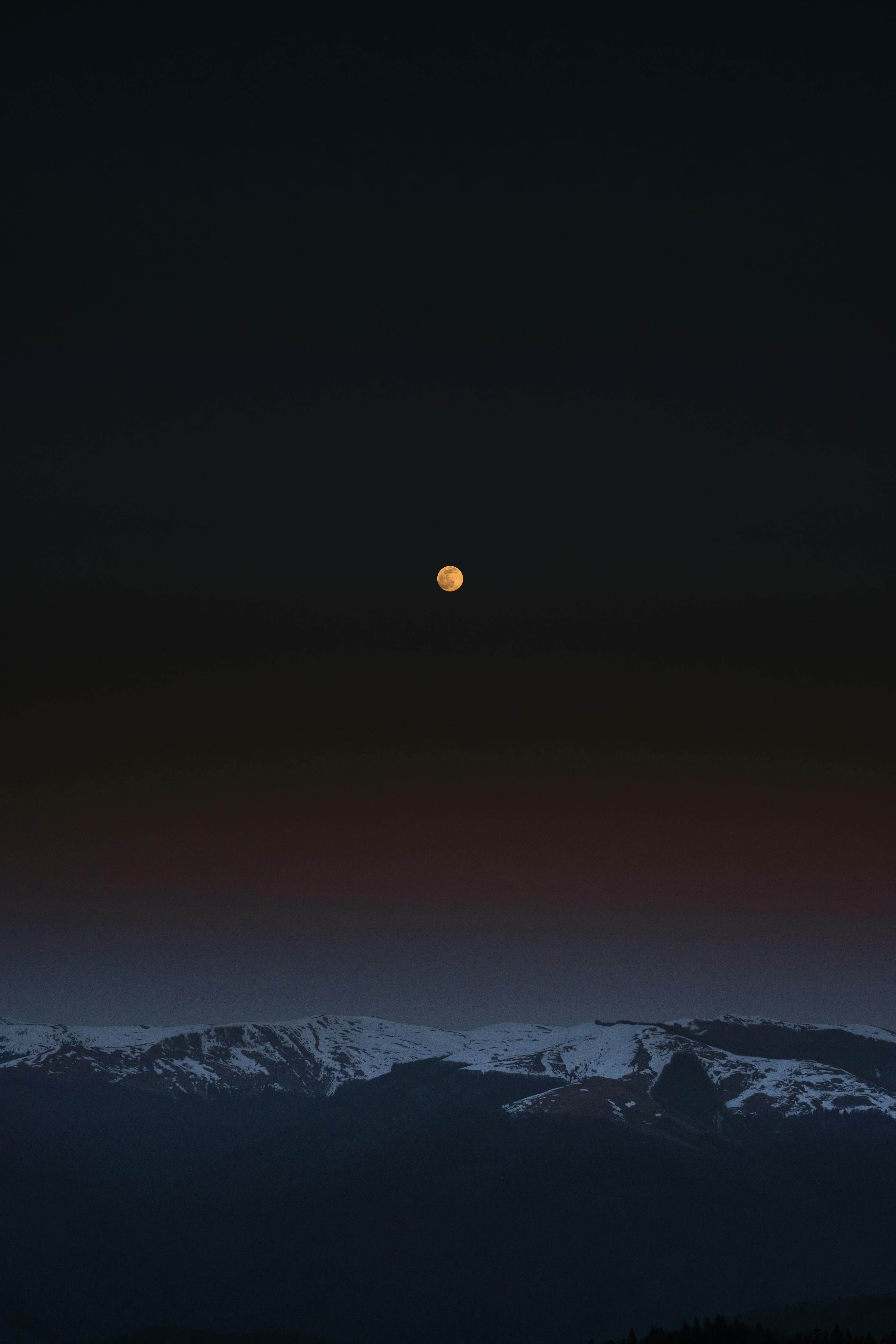 Full Moon Above the Mountain Ranges Near Town · Free Stock Photo