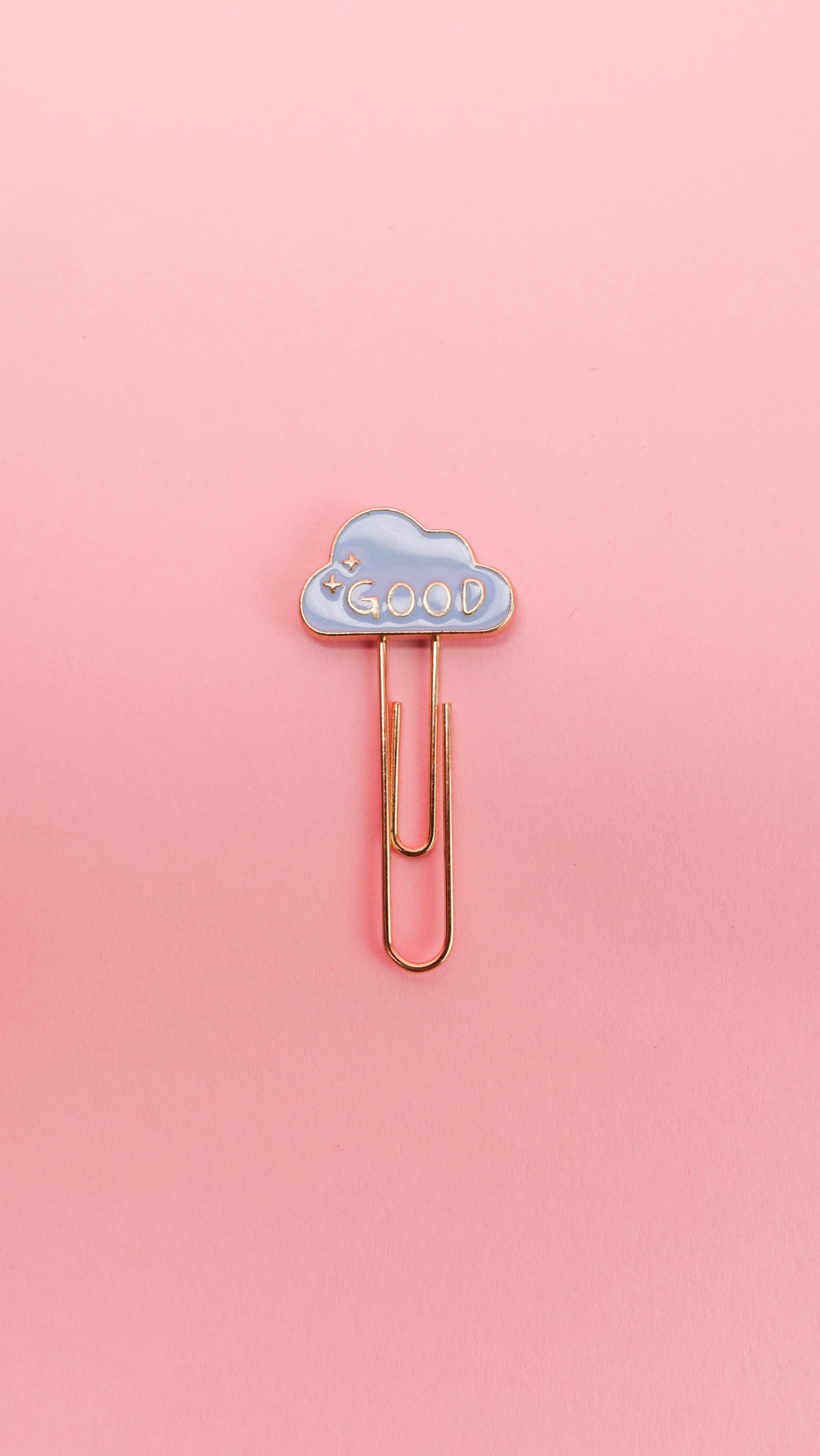 A Paper Clip on a Pink Surface · Free Stock Photo