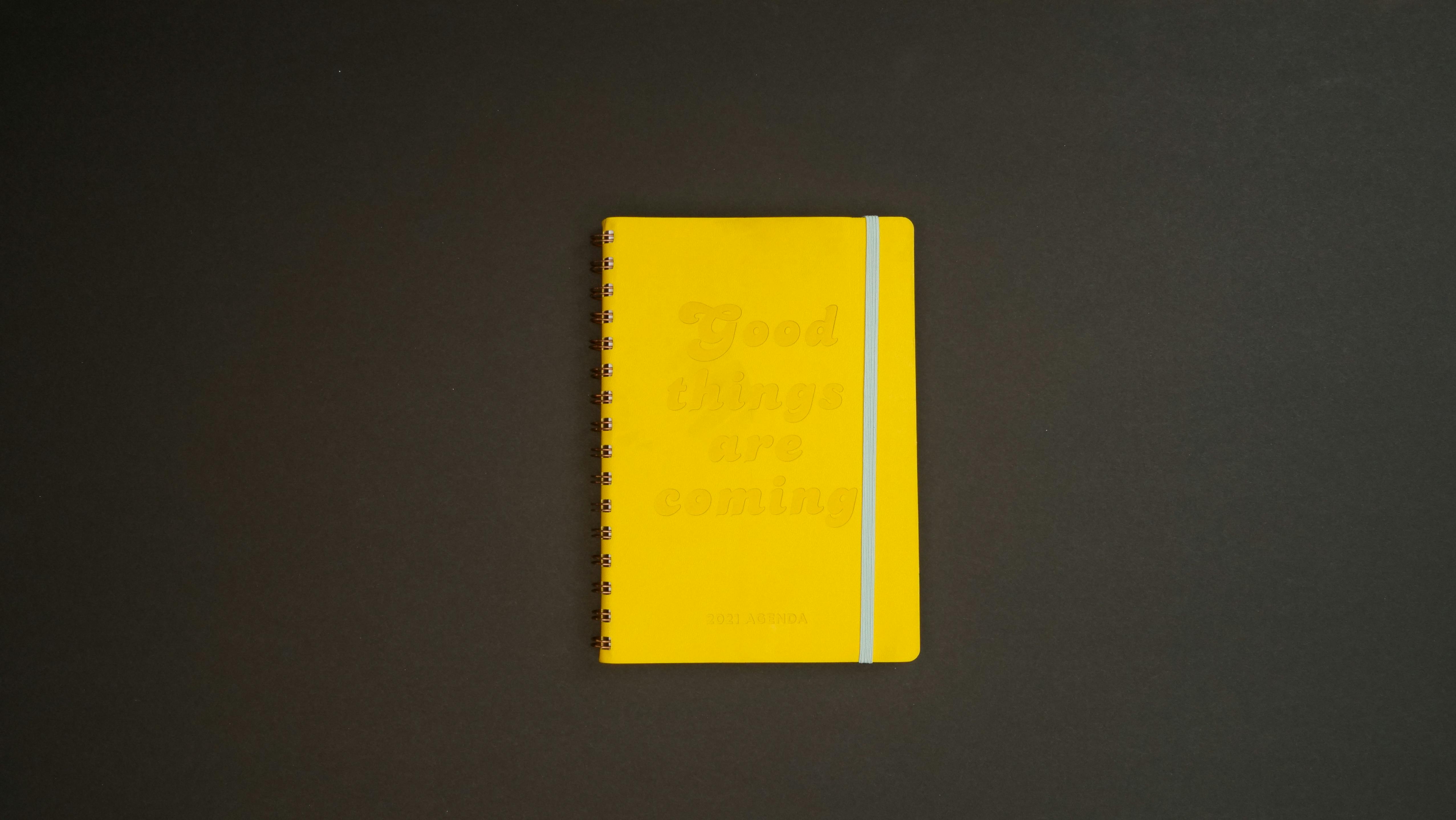 A Yellow Notebook with Spiral Binding · Free Stock Photo