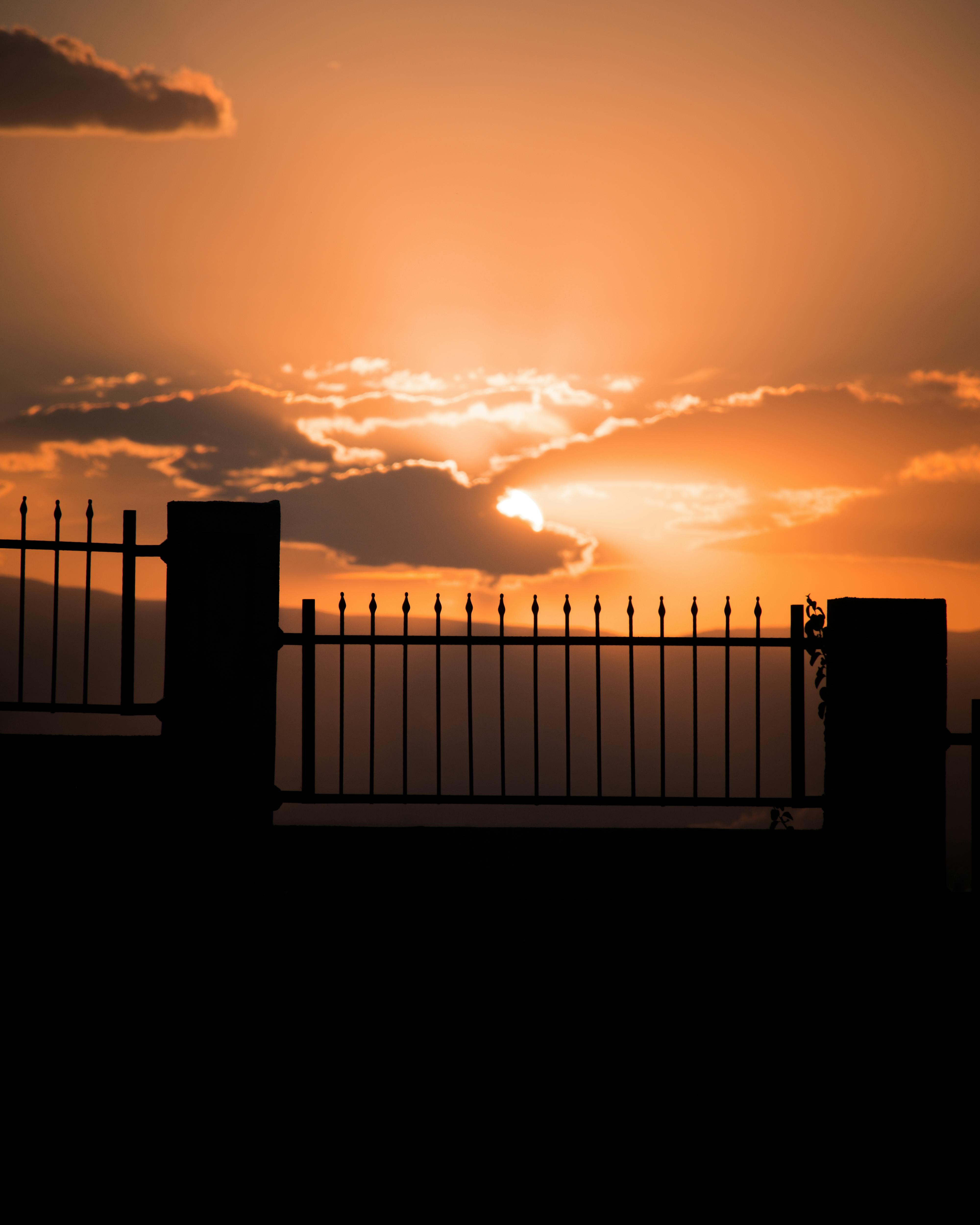 Silhouette of a Fence during Sunset · Free Stock Photo