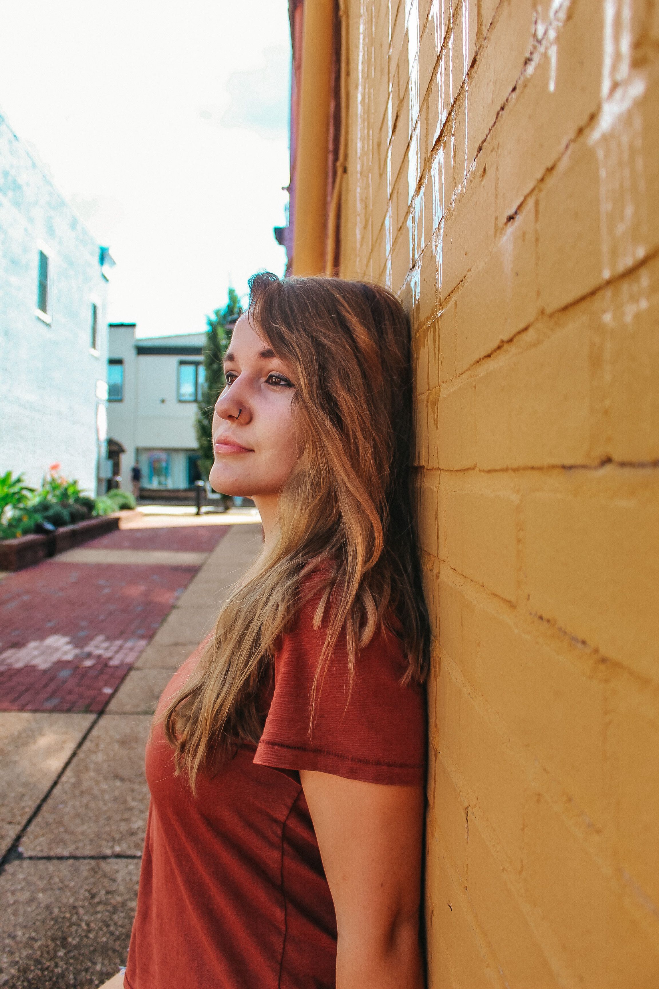 Woman Posing by Wall · Free Stock Photo