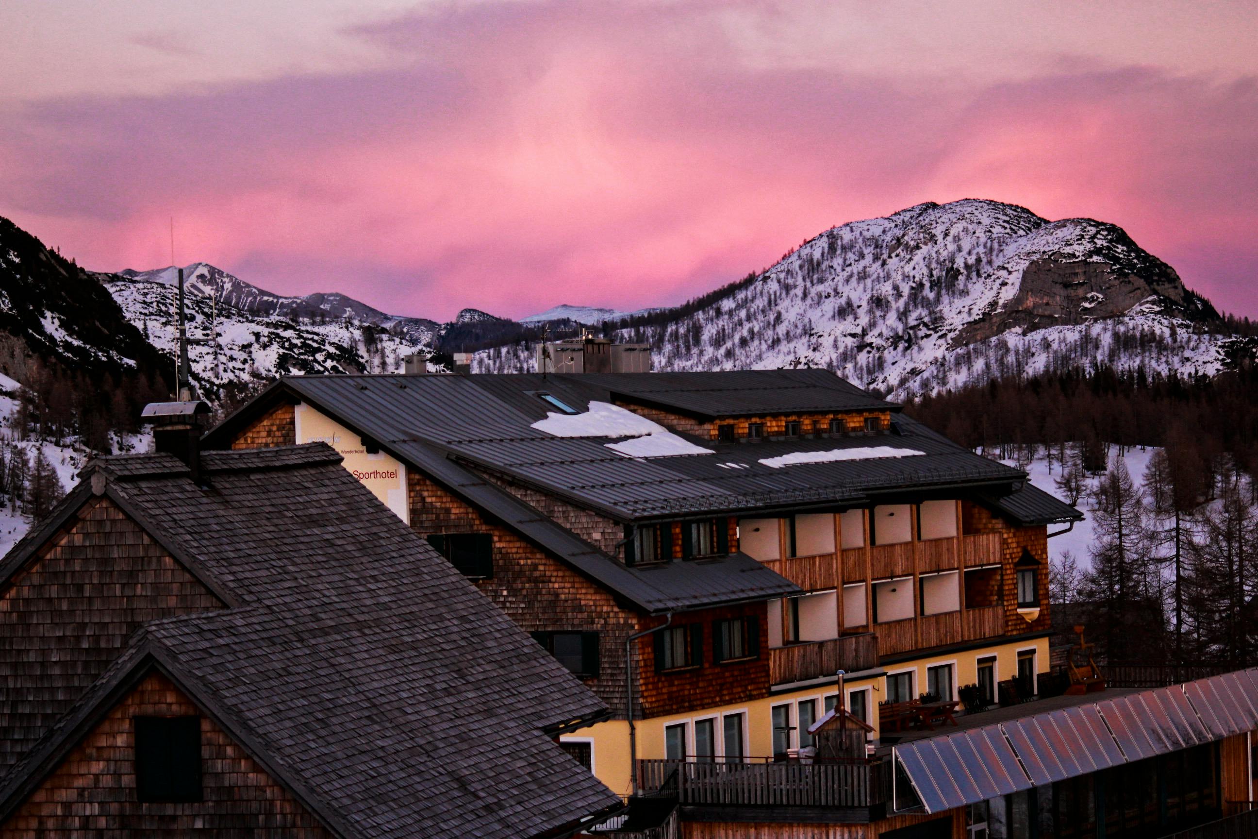 Buildings Near Snow Covered Mountain · Free Stock Photo