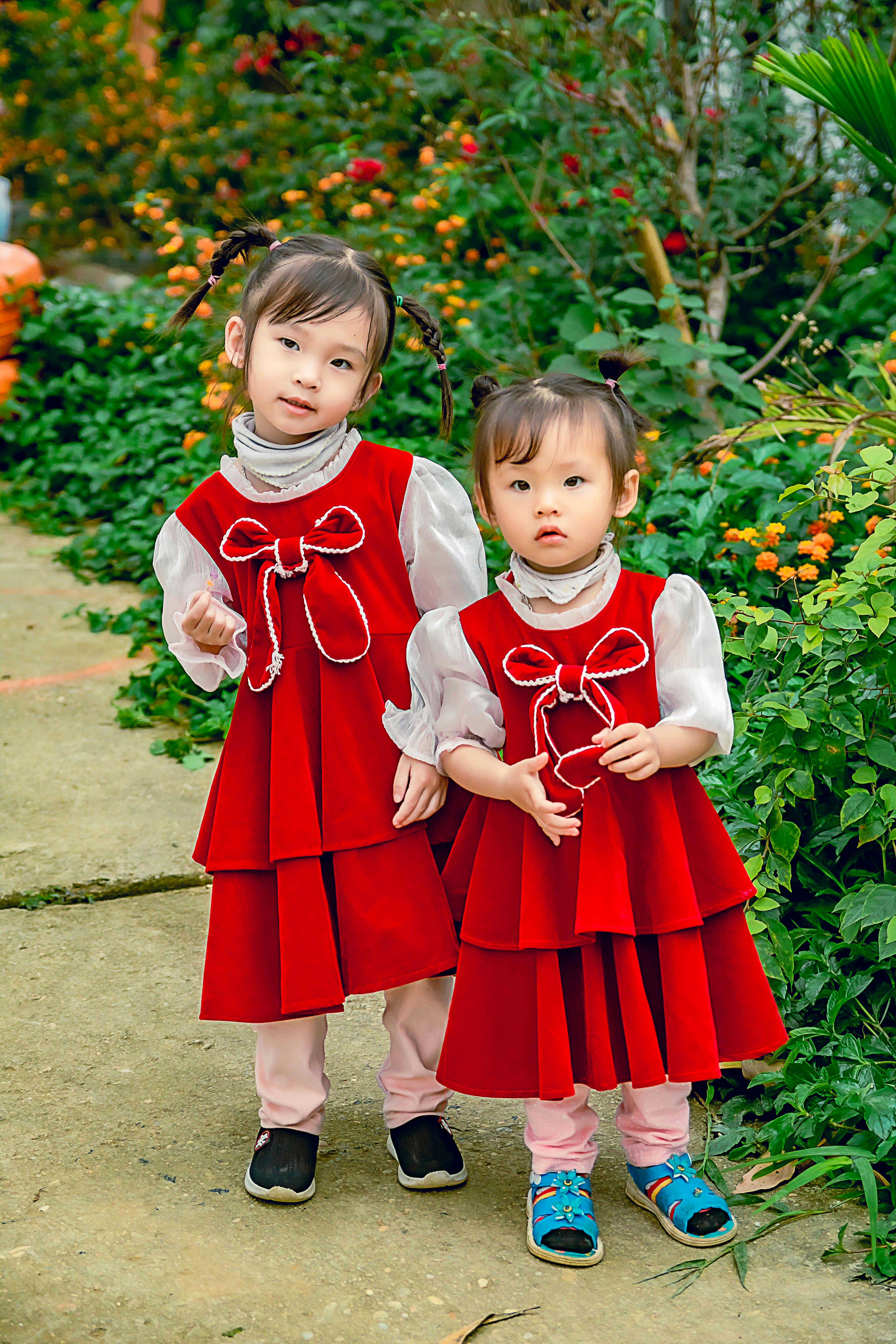 Cute Girls in Red Dresses · Free Stock Photo