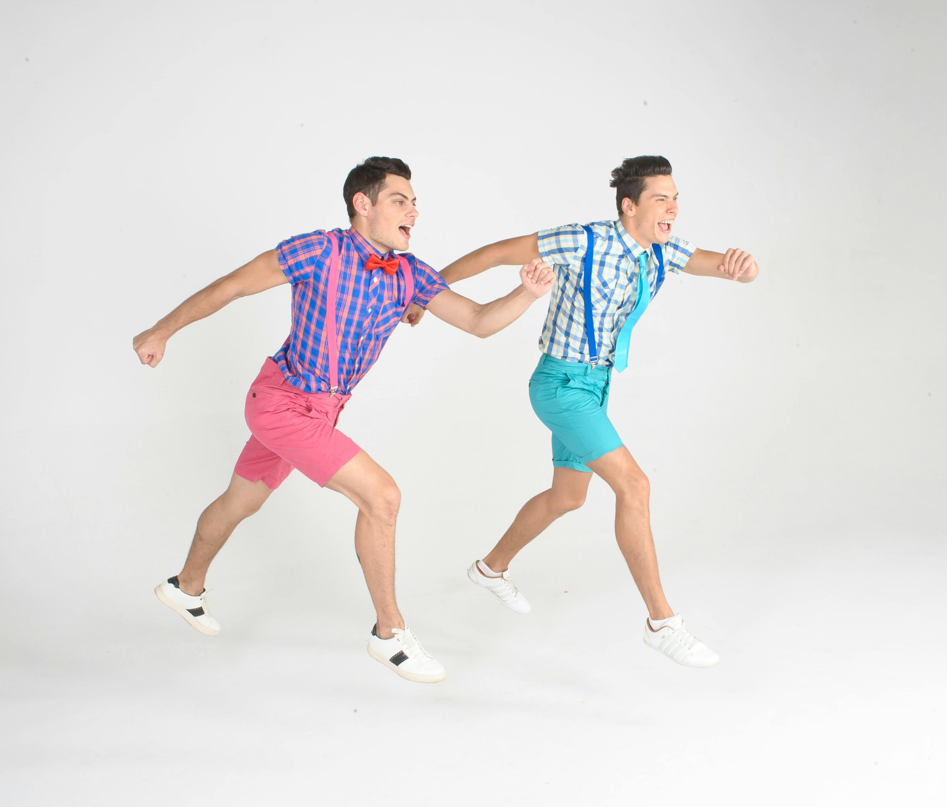 Studio Shot of Two Men Jumping · Free Stock Photo