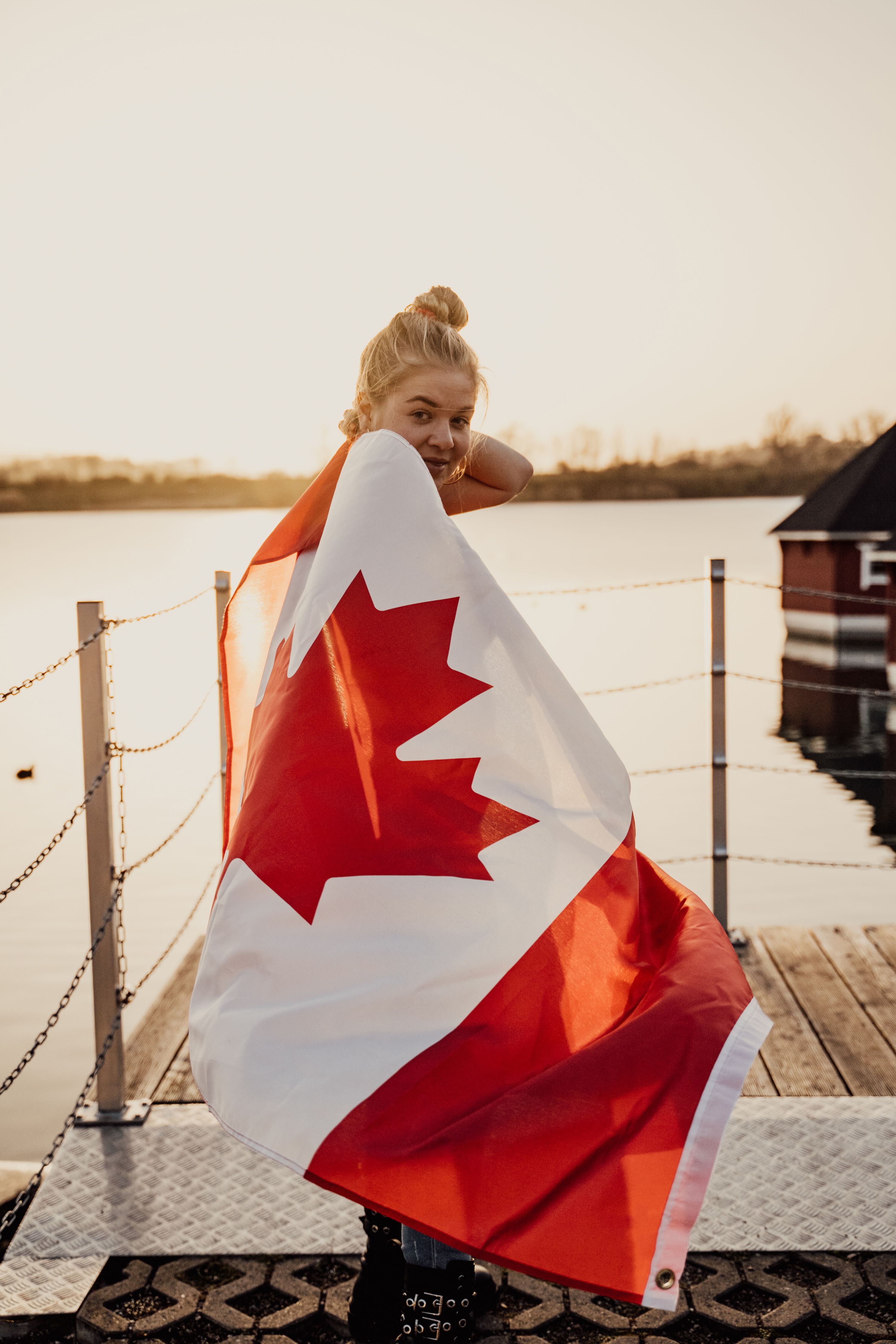 A Woman Wrapped with Canadian Flag on Her Body Standing on the Wooden ...