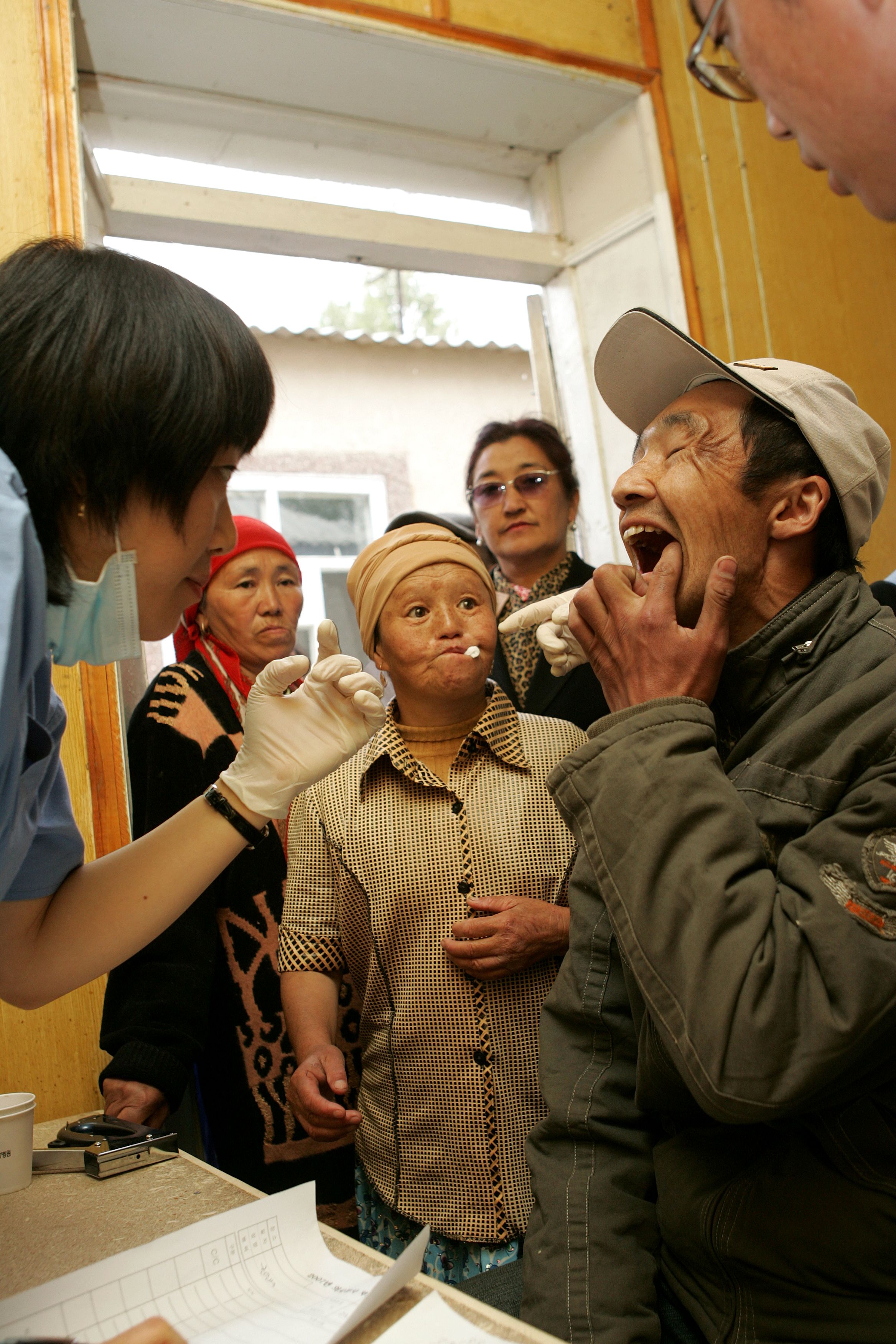 A Dentist Looking at the Teeth of the Patient · Free Stock Photo