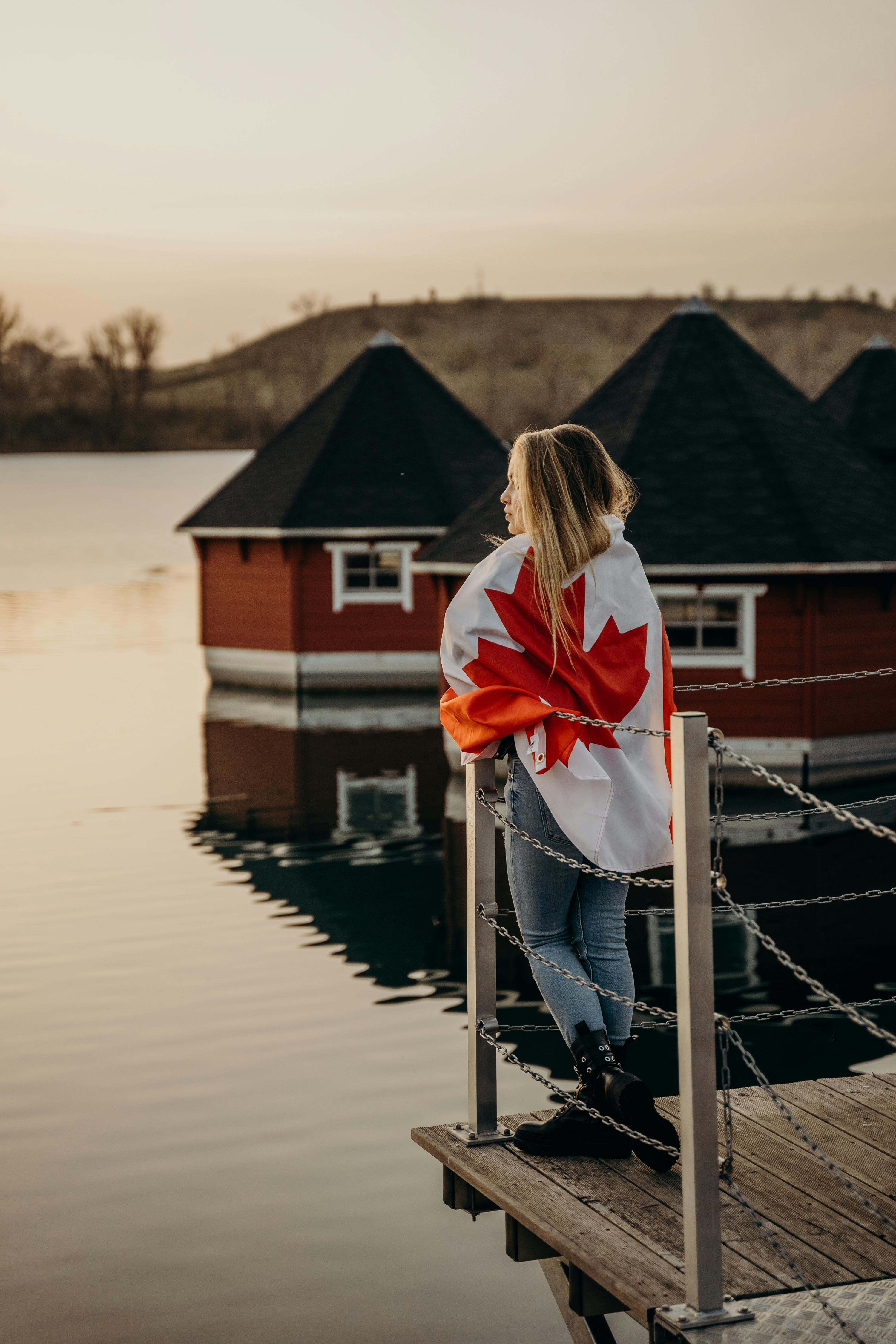 Person holding a Canadian Flag · Free Stock Photo