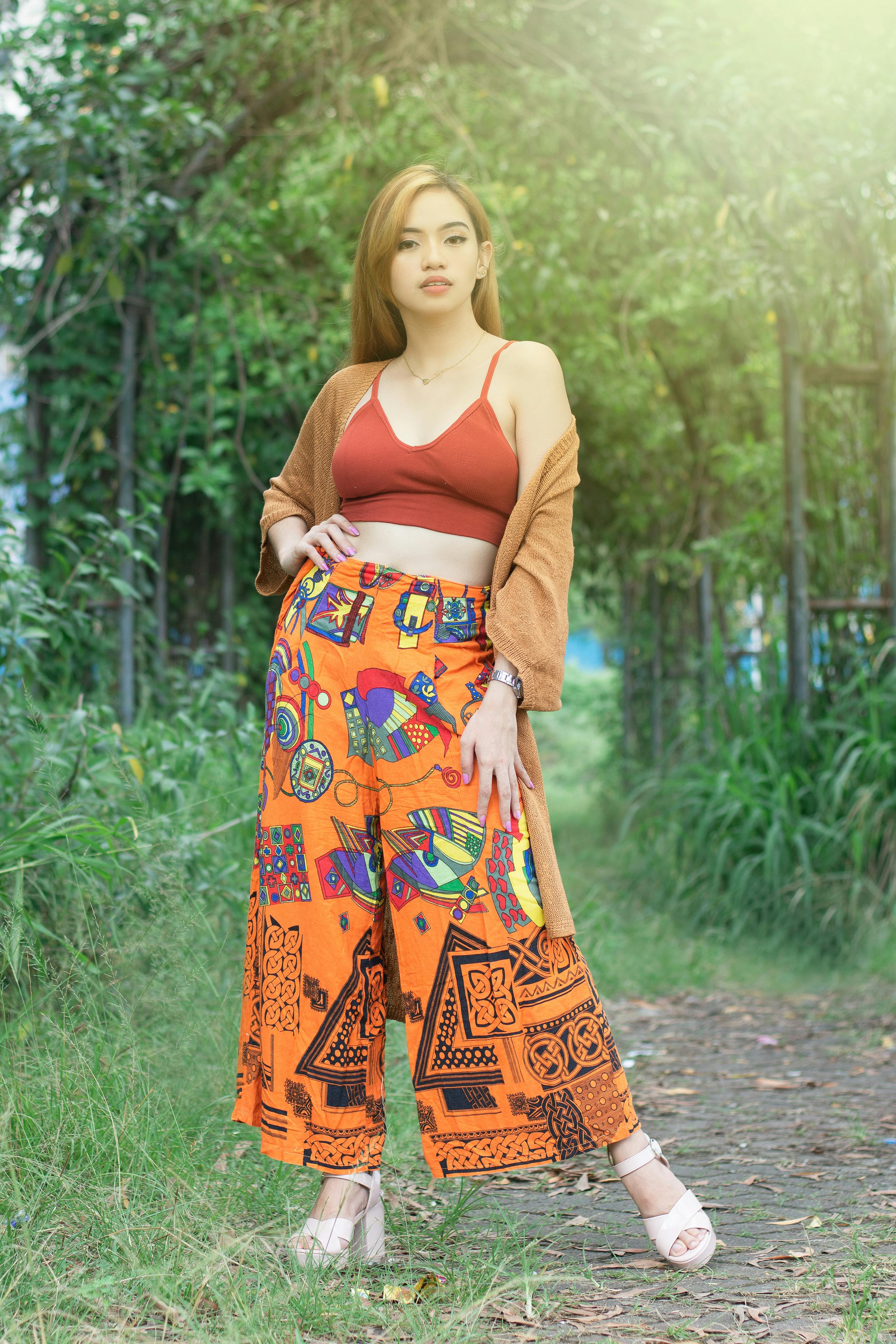 Woman In A Red Crop Top Posing With Her Hand On Her Waist · Free Stock