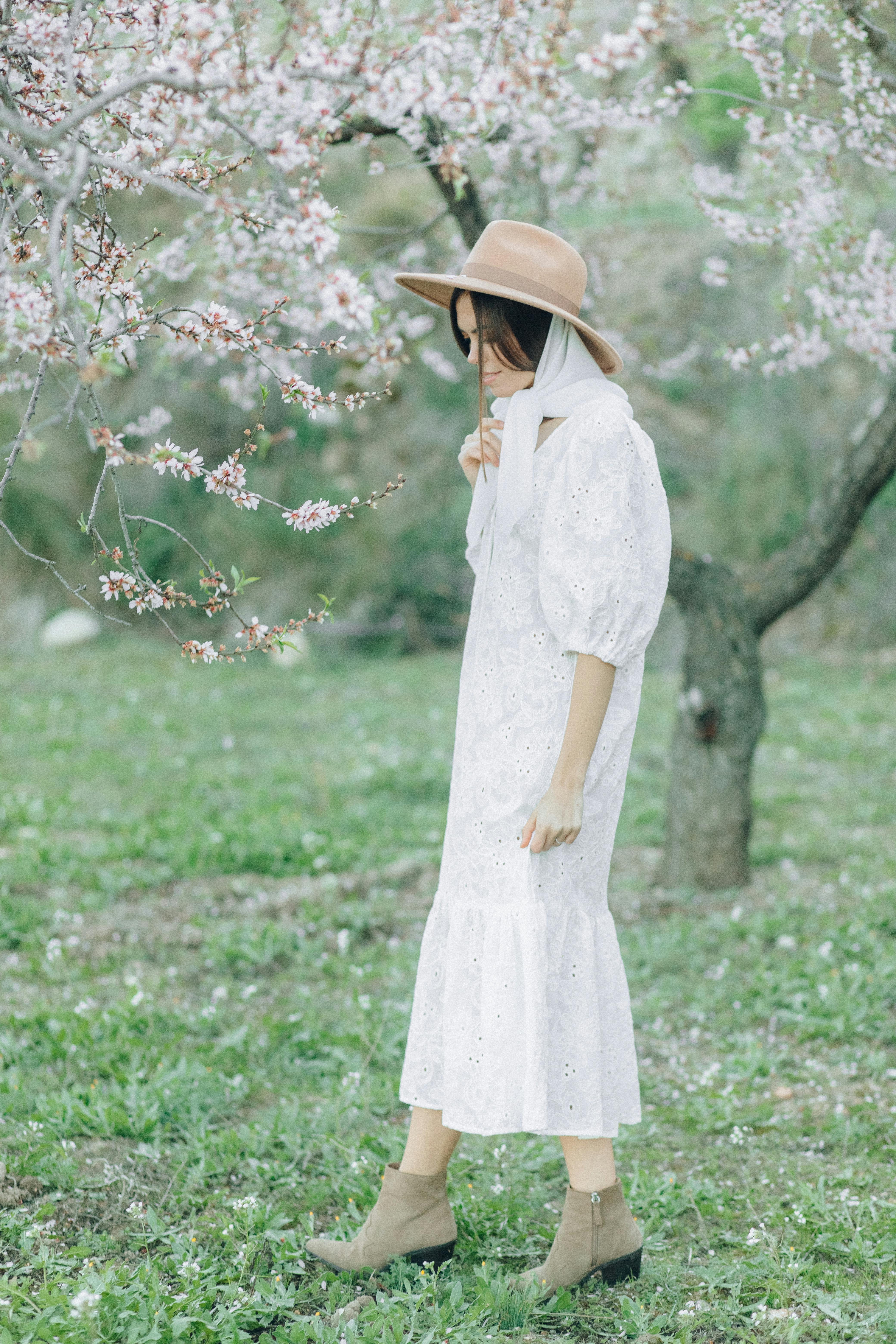 Woman in White Dress standing Near Cherry Blossoms · Free Stock Photo