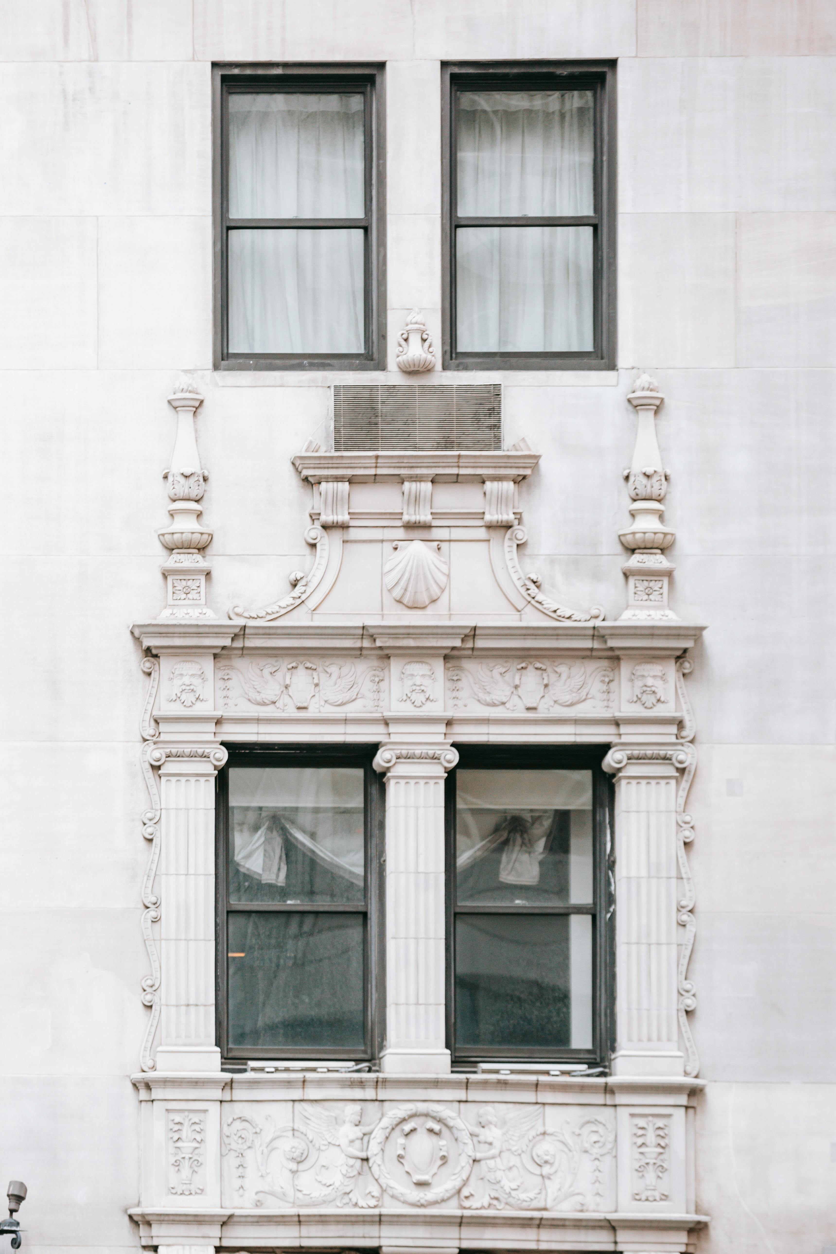 Old stone building exterior with decor in town · Free Stock Photo