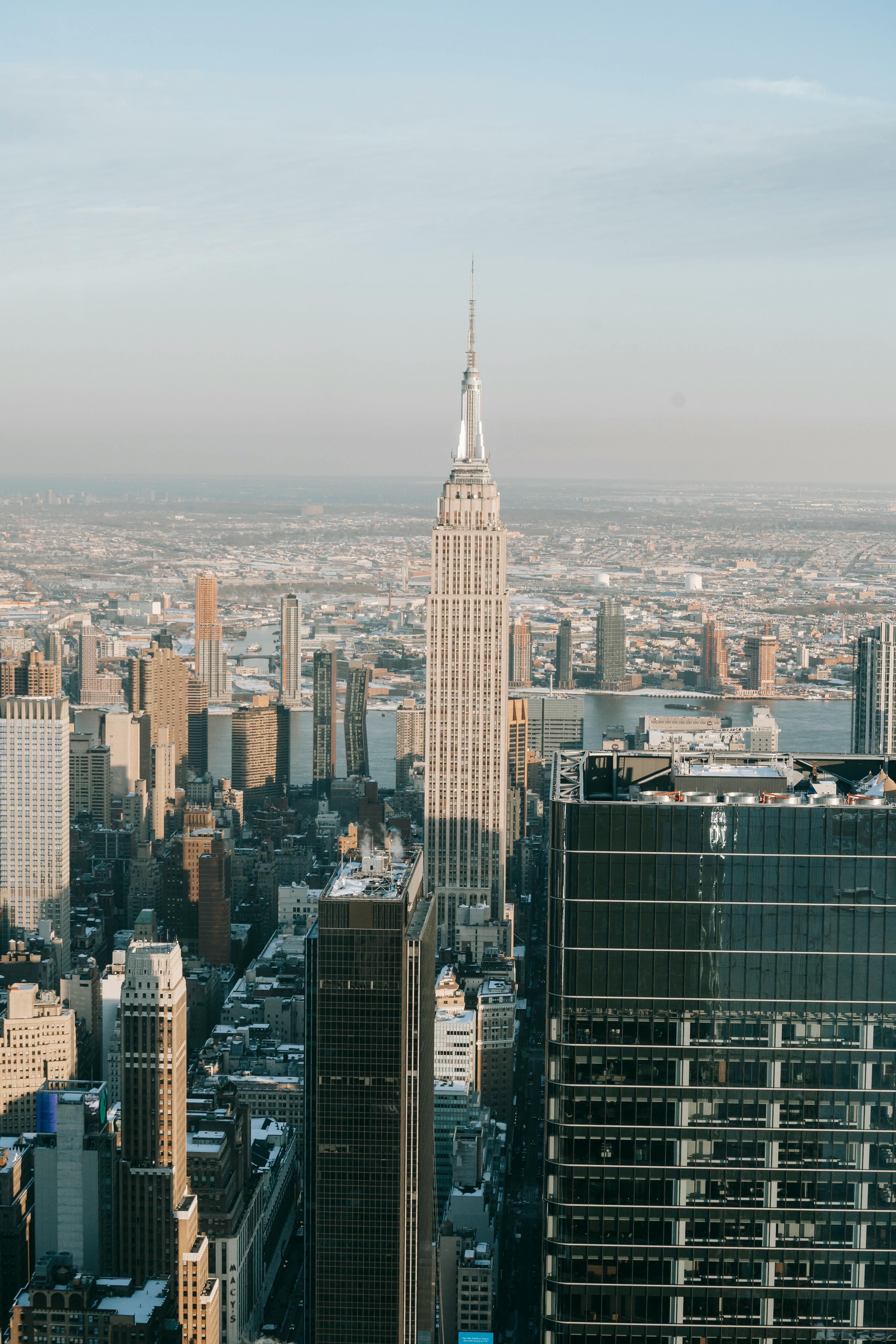 Cityscape of megapolis located on river shore at night · Free Stock Photo