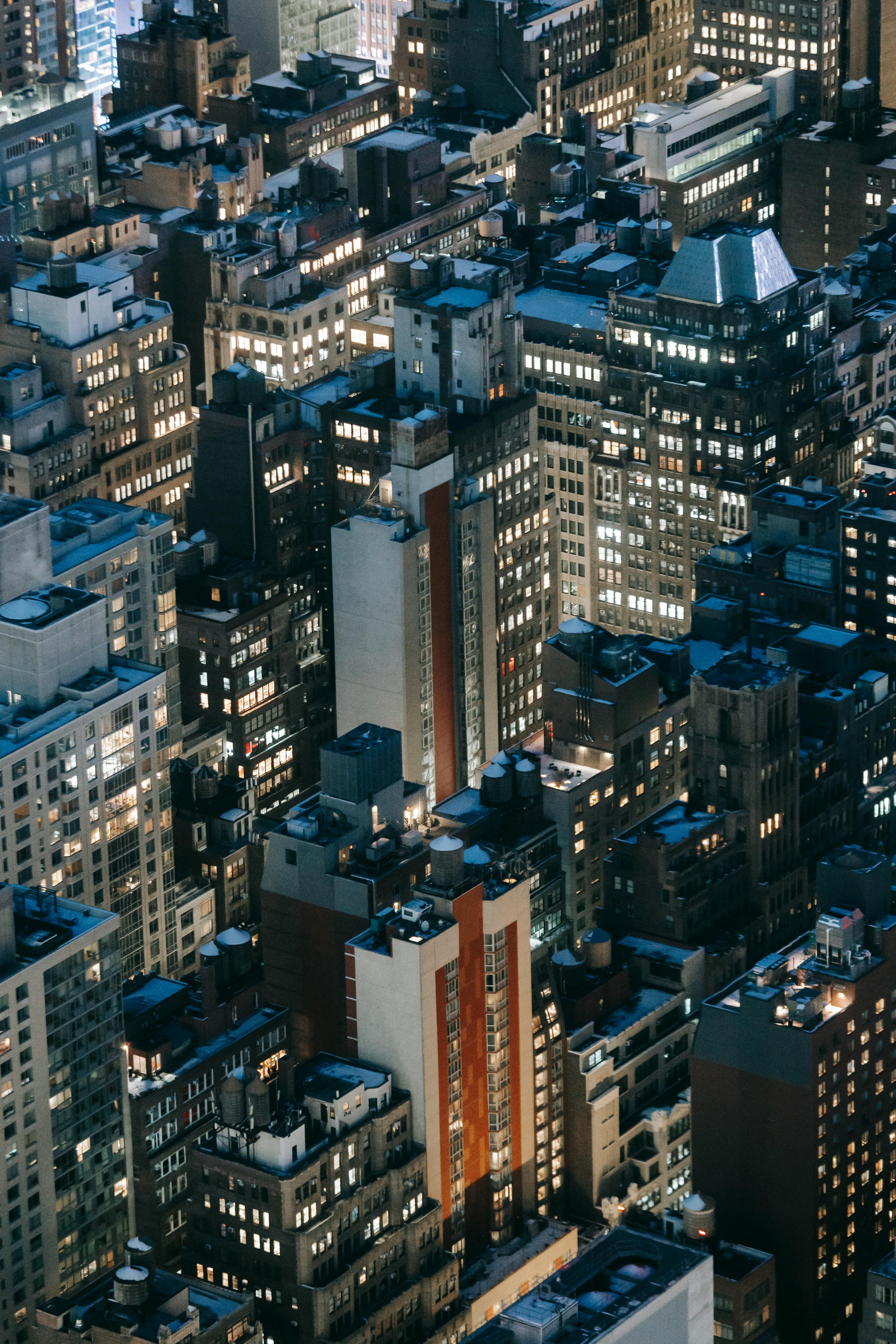 Modern buildings with glowing lights · Free Stock Photo
