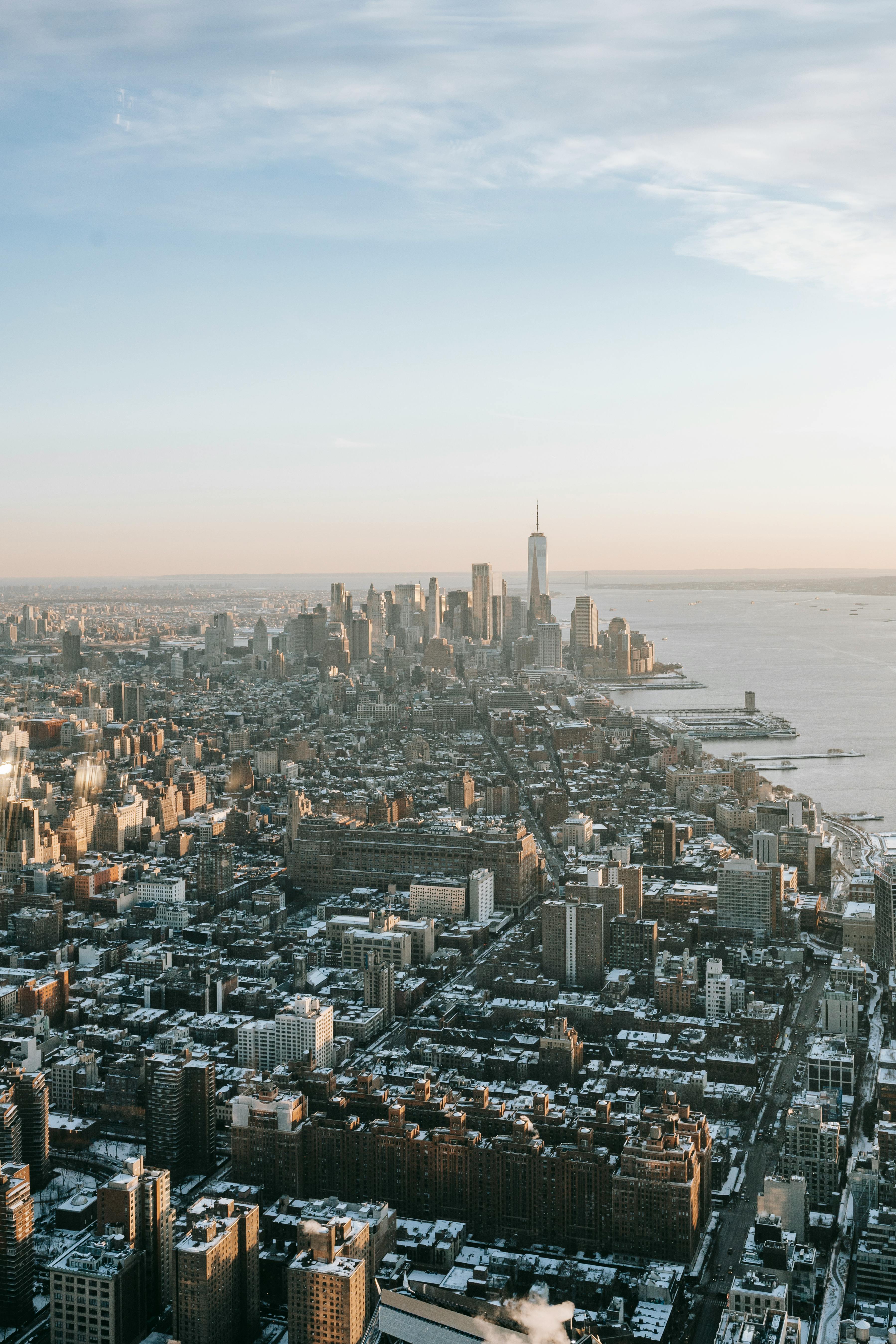 Cityscape with buildings near sea · Free Stock Photo