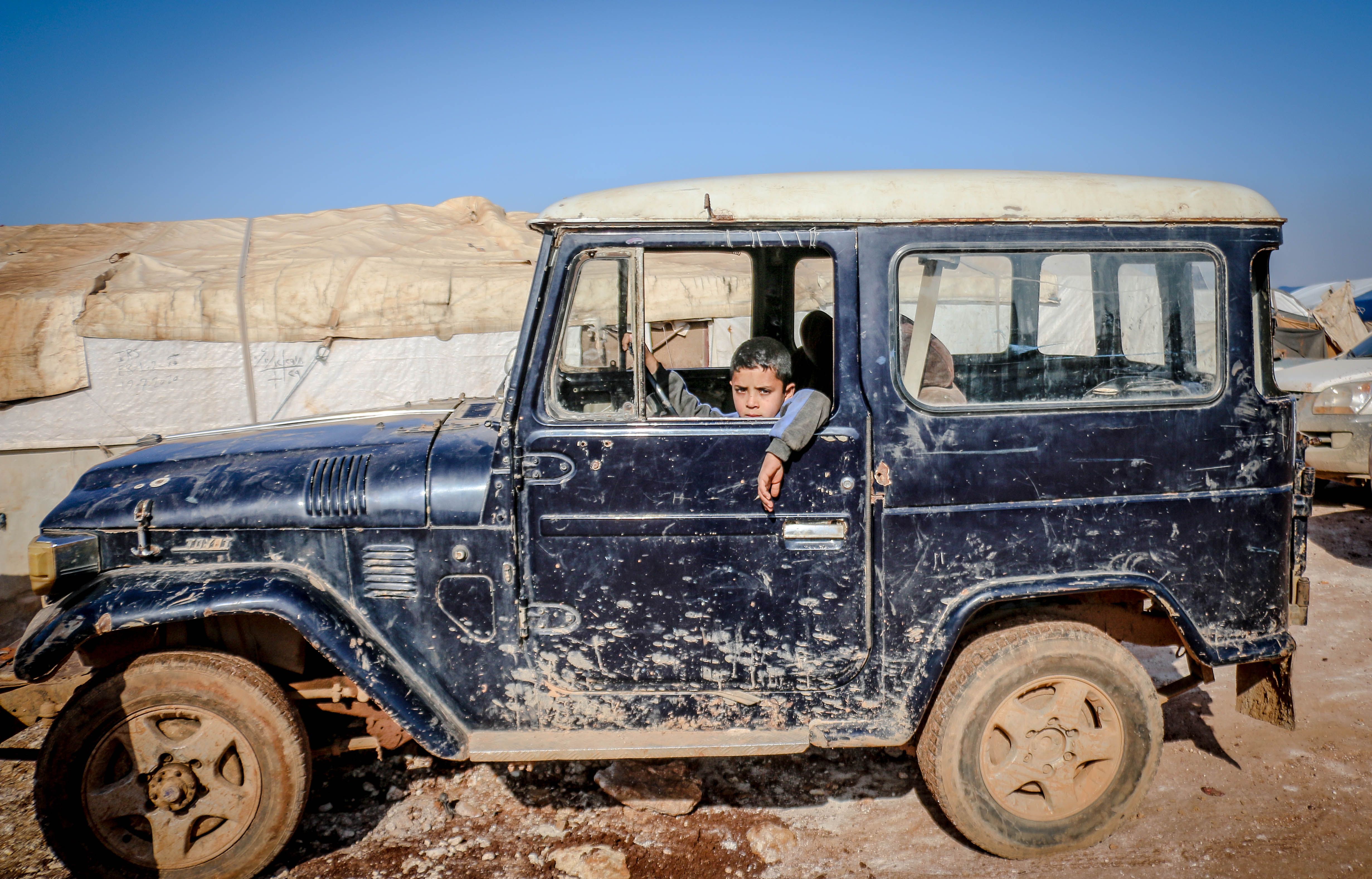 A Boy Riding a Jeep · Free Stock Photo