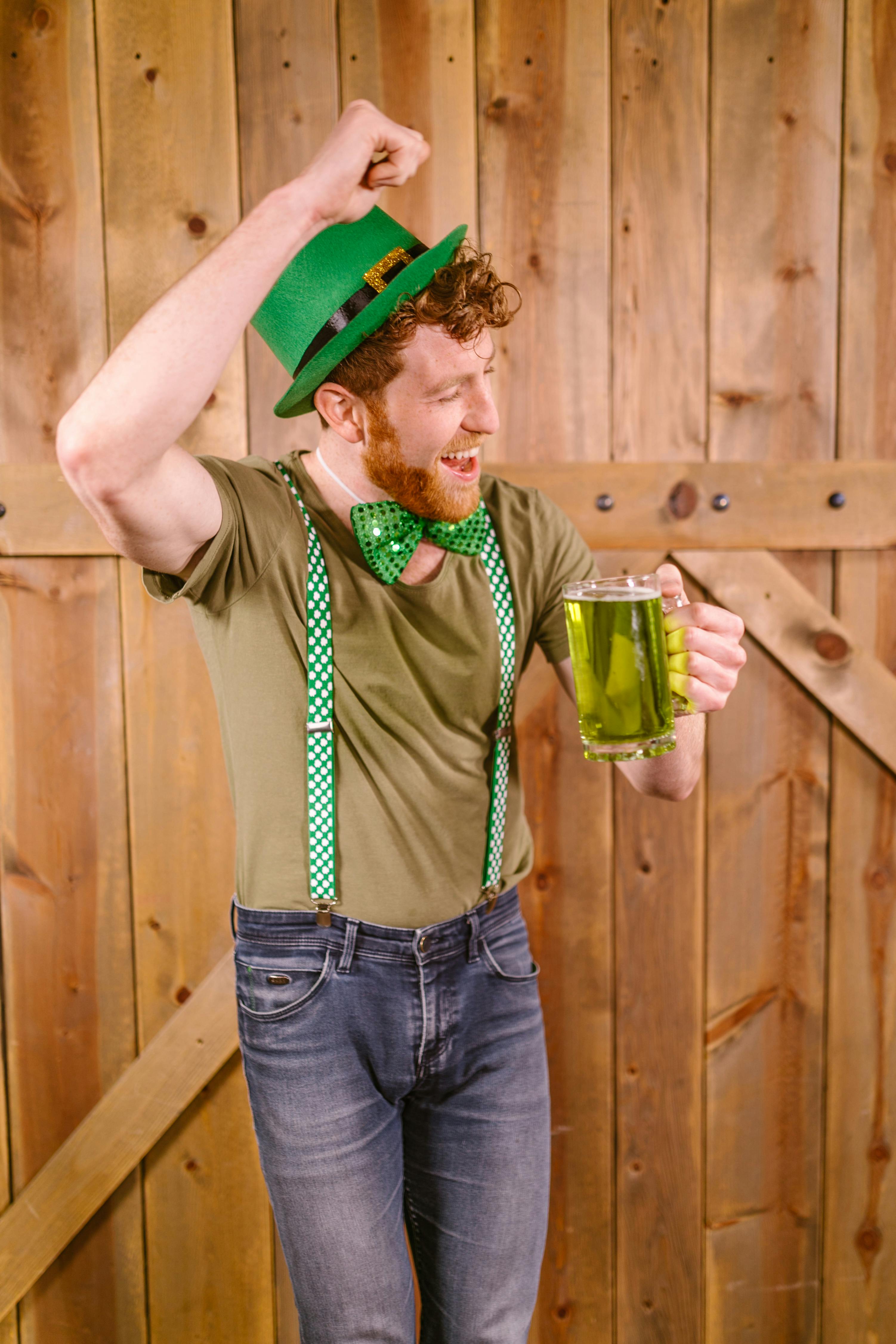 Groovy Man holding a Jug of Green Beer · Free Stock Photo